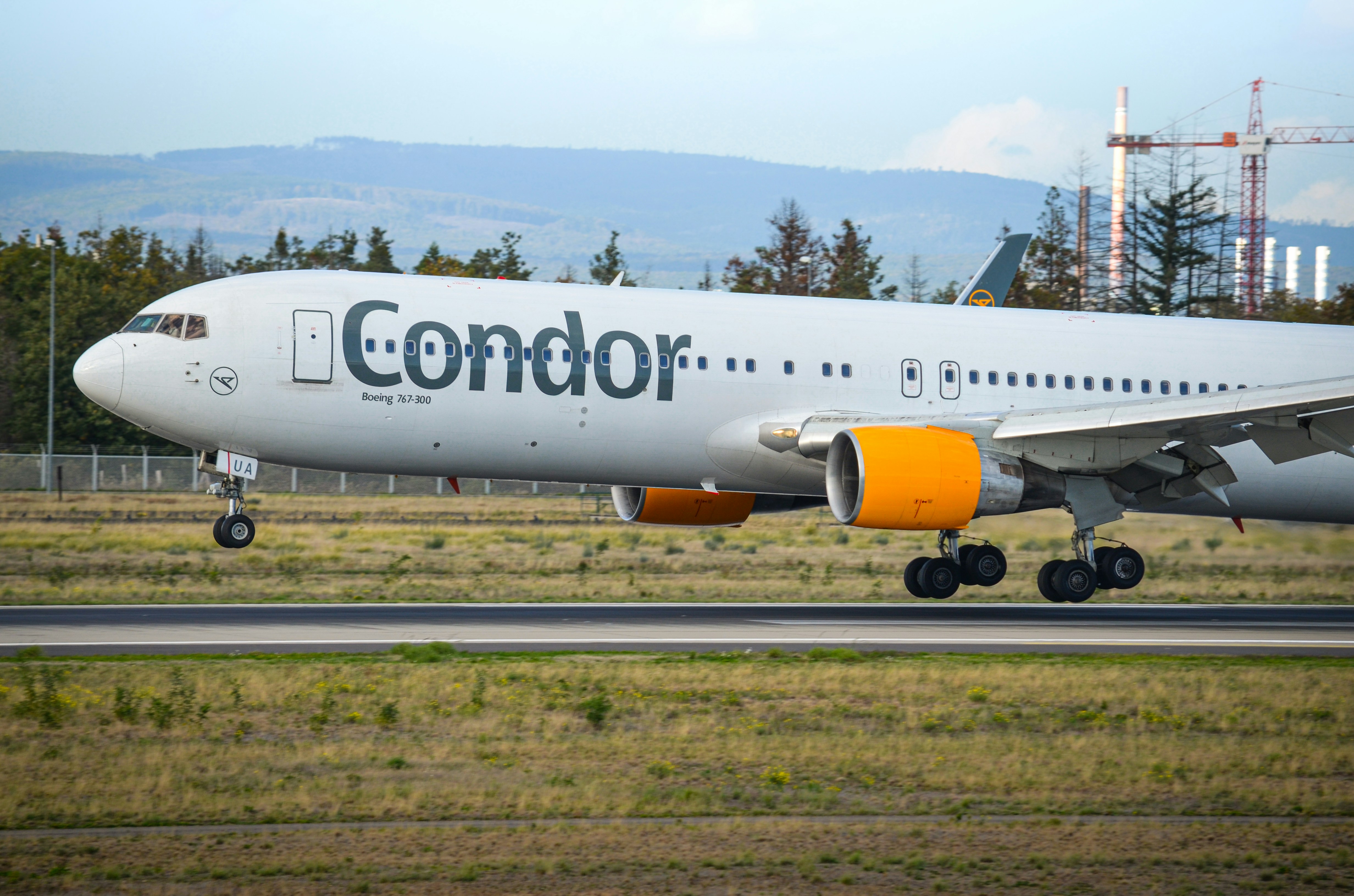 Condor on the Tarmac: Close-Up of the Jet's Nose and Engine in Quiet Afternoon