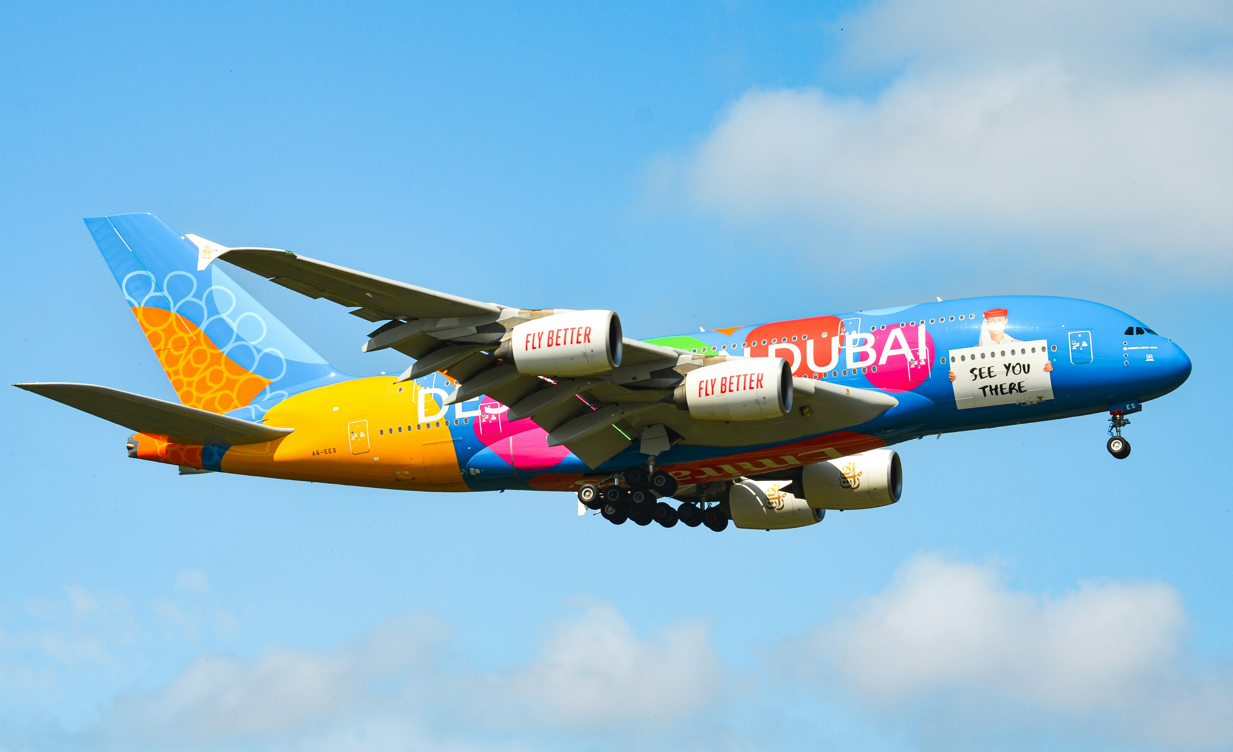 Colorful Dubai A380 in Flight: A Sky-Blue Soaring Livery