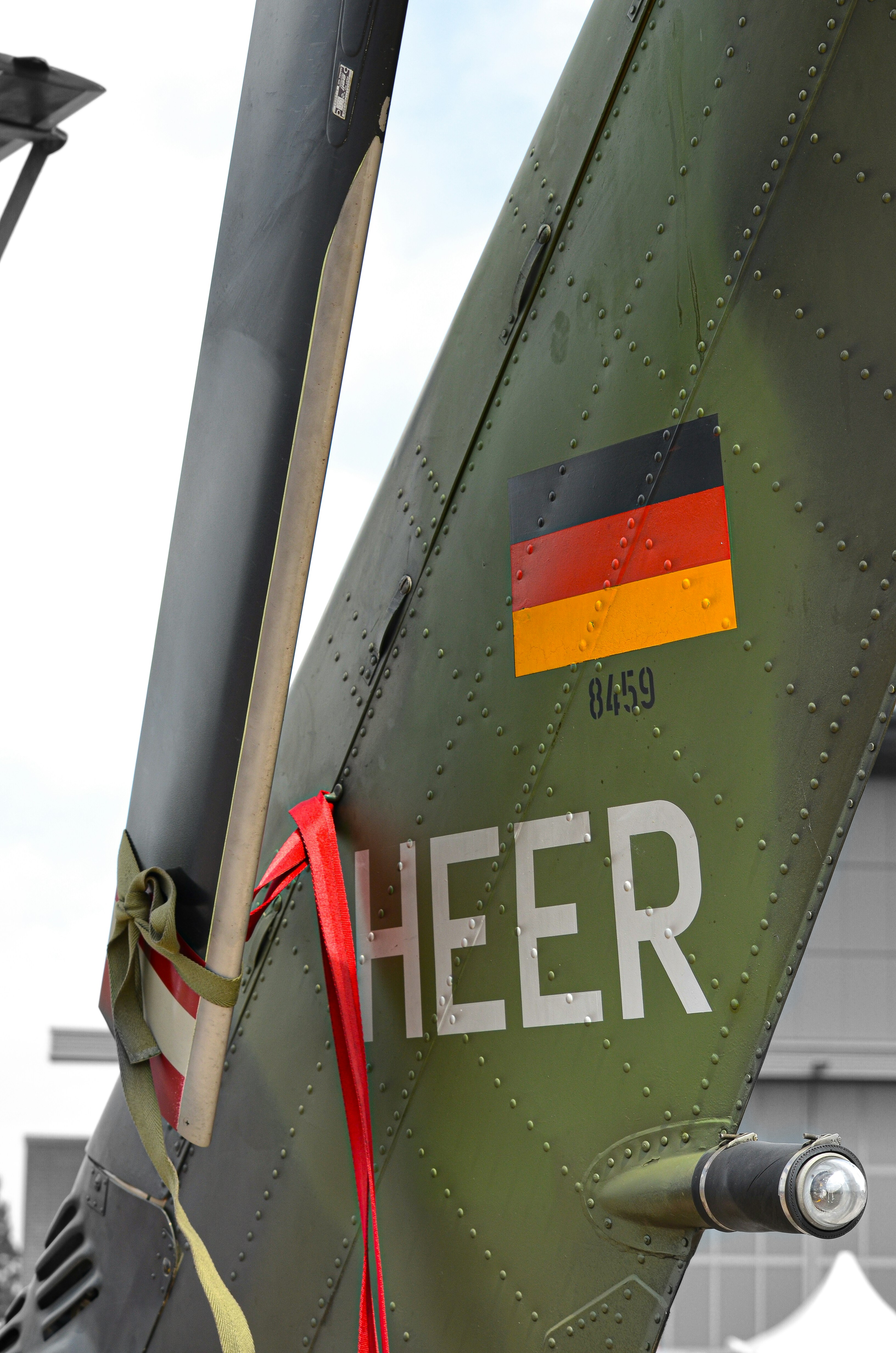 Military helicopter tail with German flag stenciled and ribbon tags
