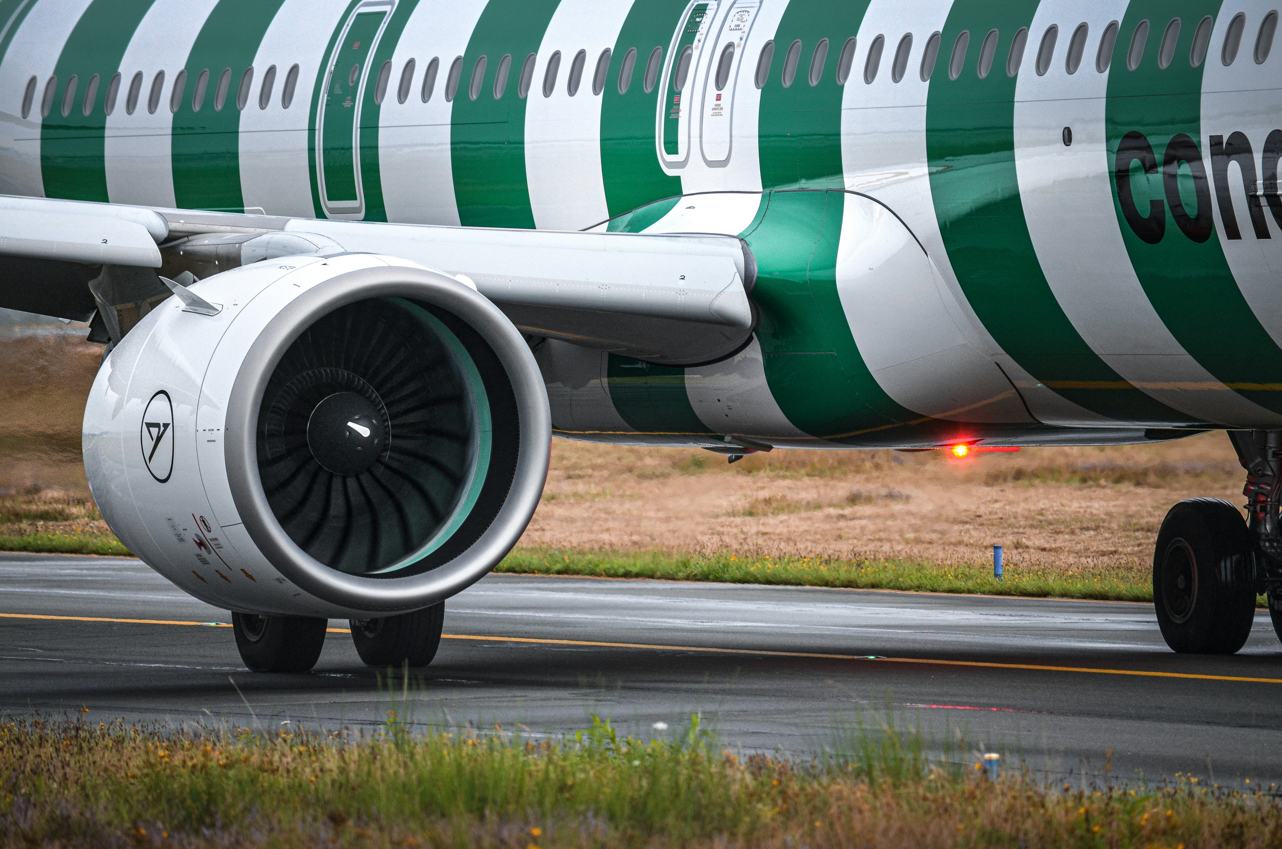 Close-up of an airplane engine on a runway