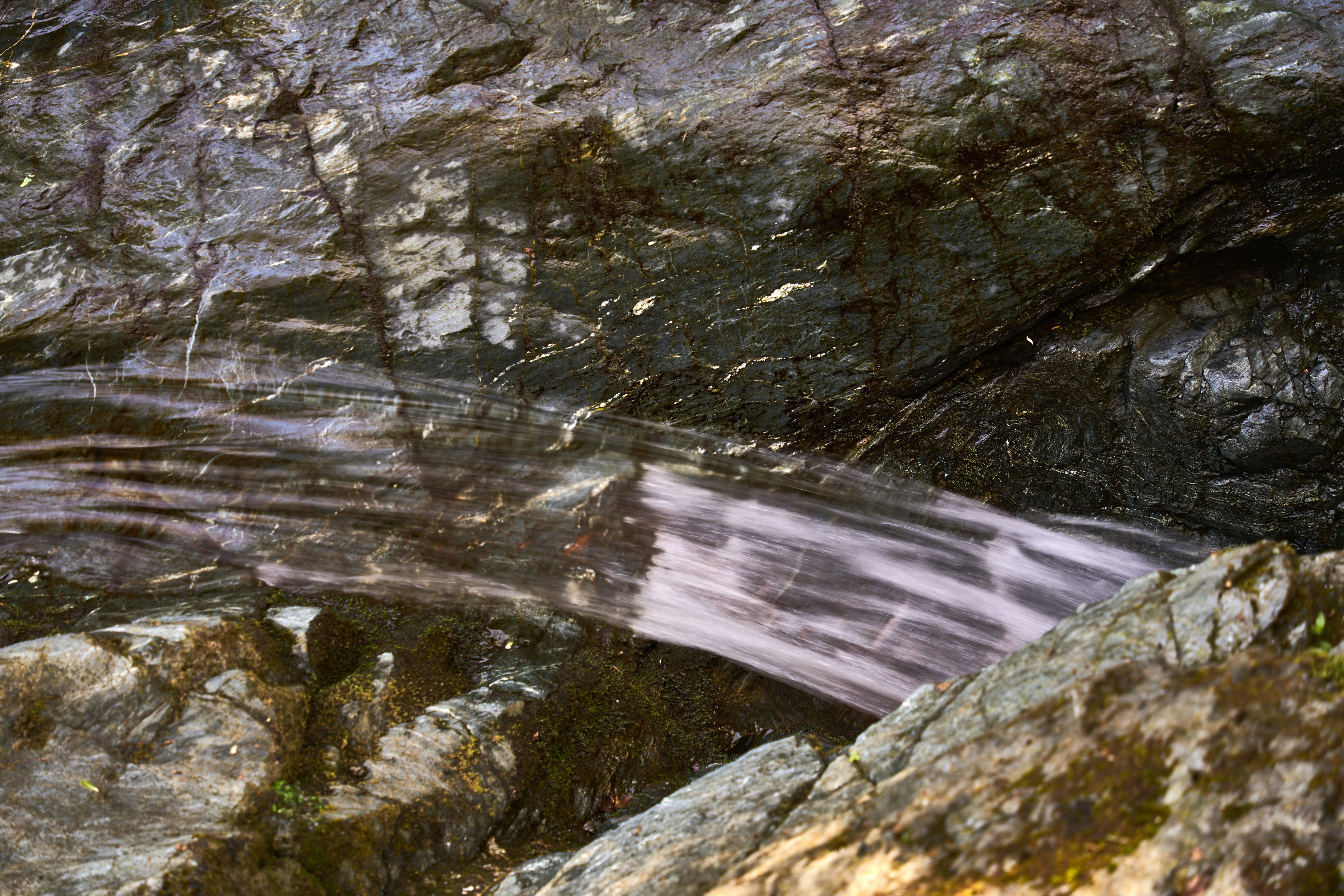 Silky Stream Cutting Through Jagged Rock