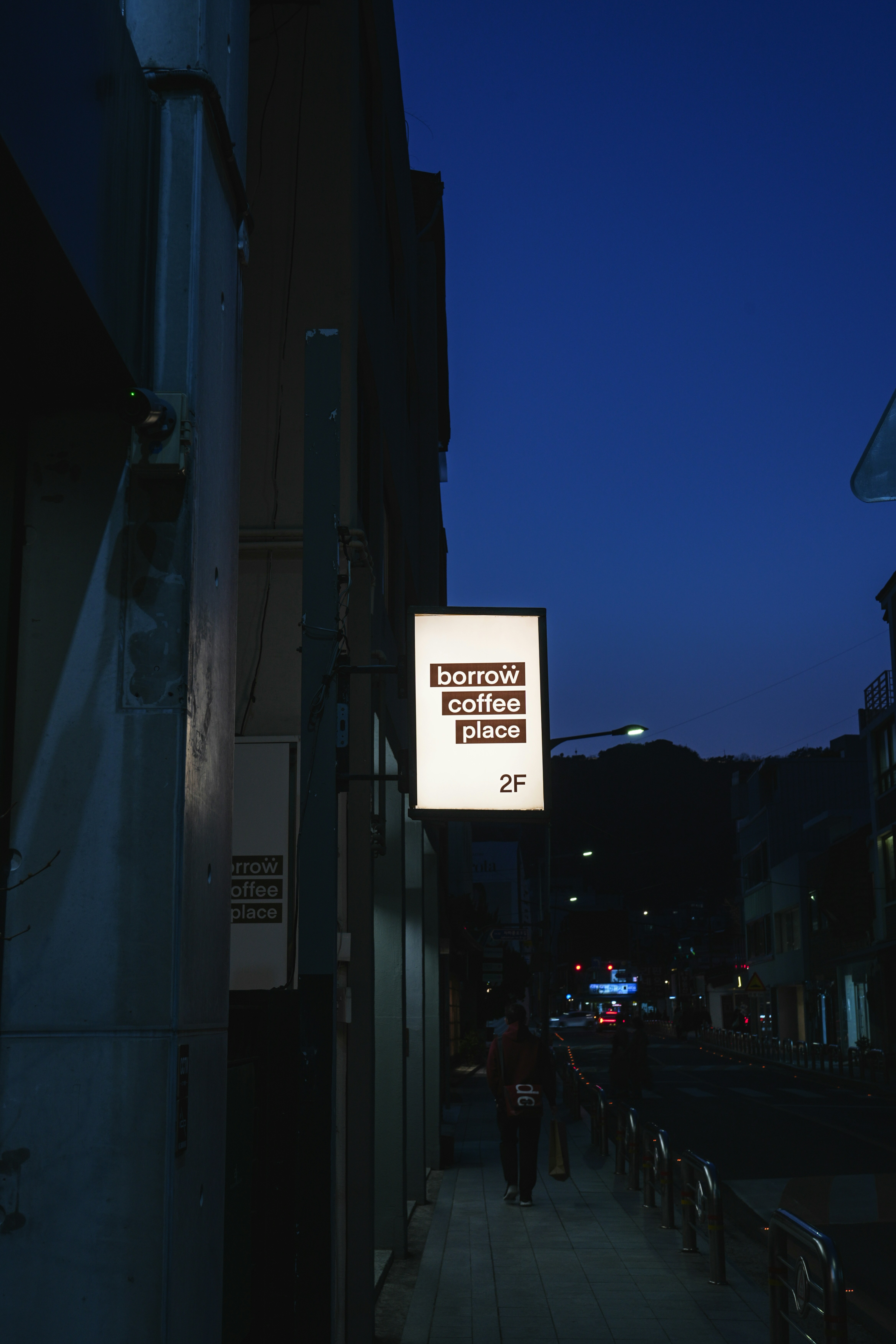Signs of Night: A Quiet City Block by the Coffee Spot