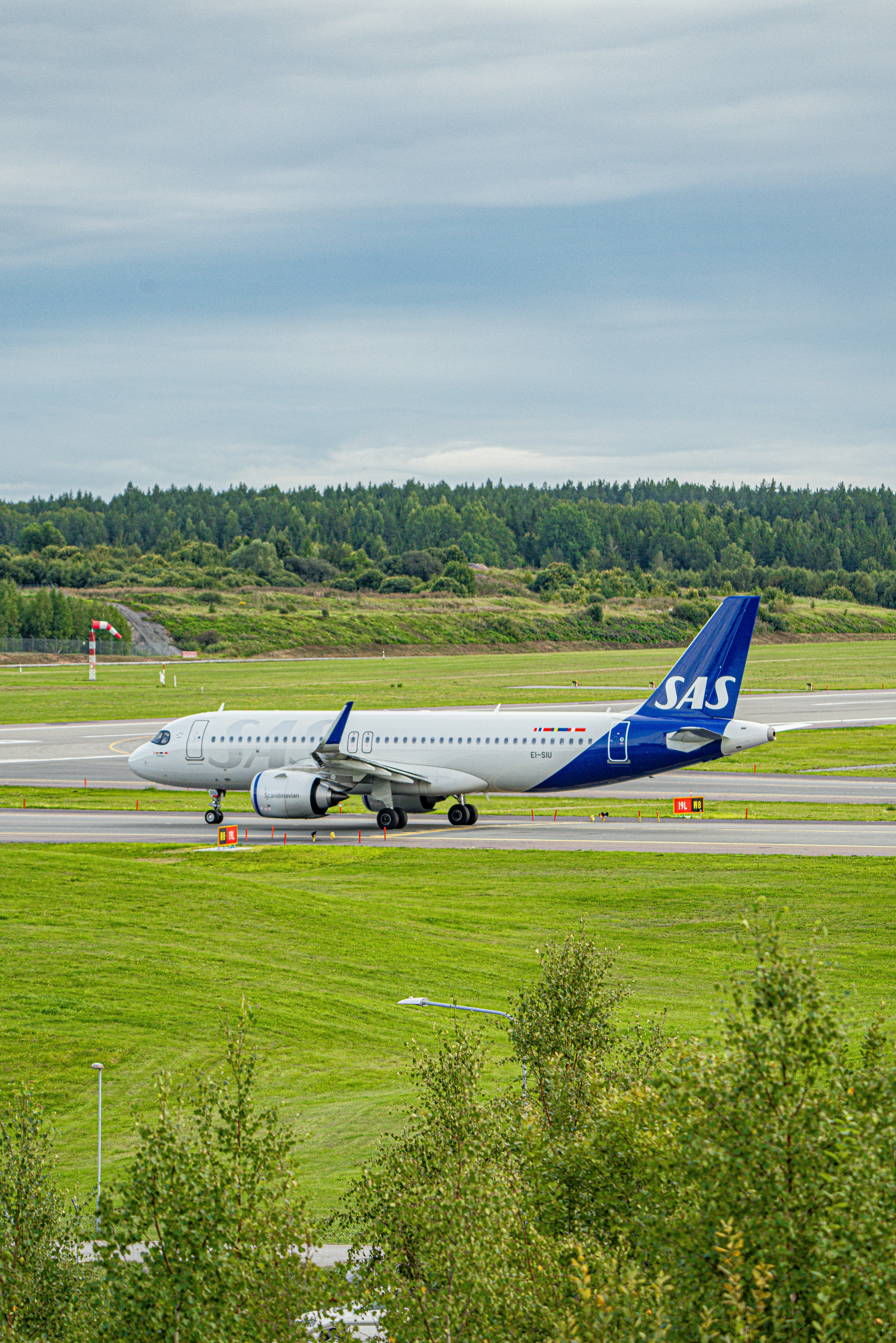 SAS Jet On Taxiway Beneath a Calm Sky