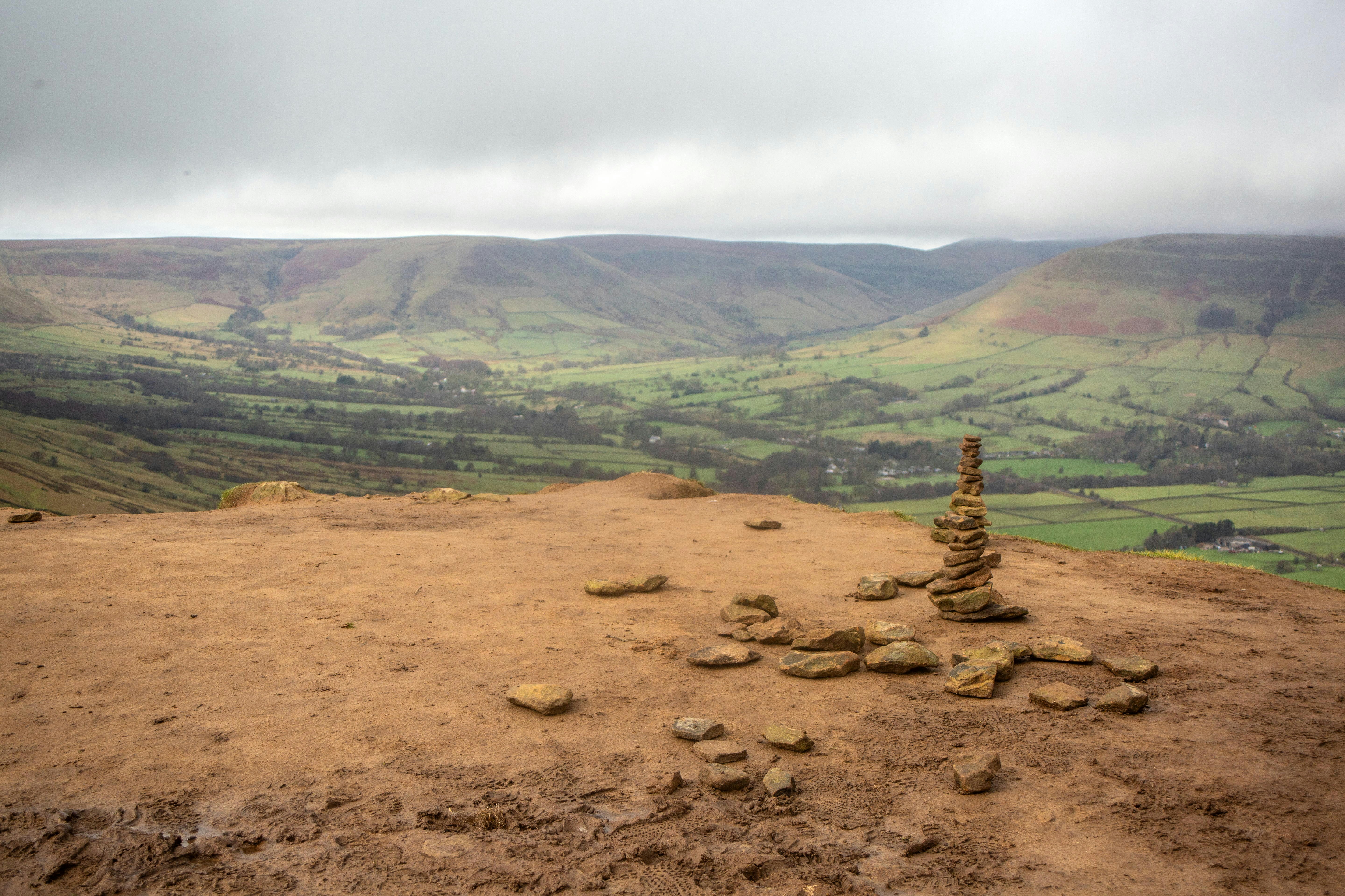 Stacked Stones on a Winding Highland Plateau