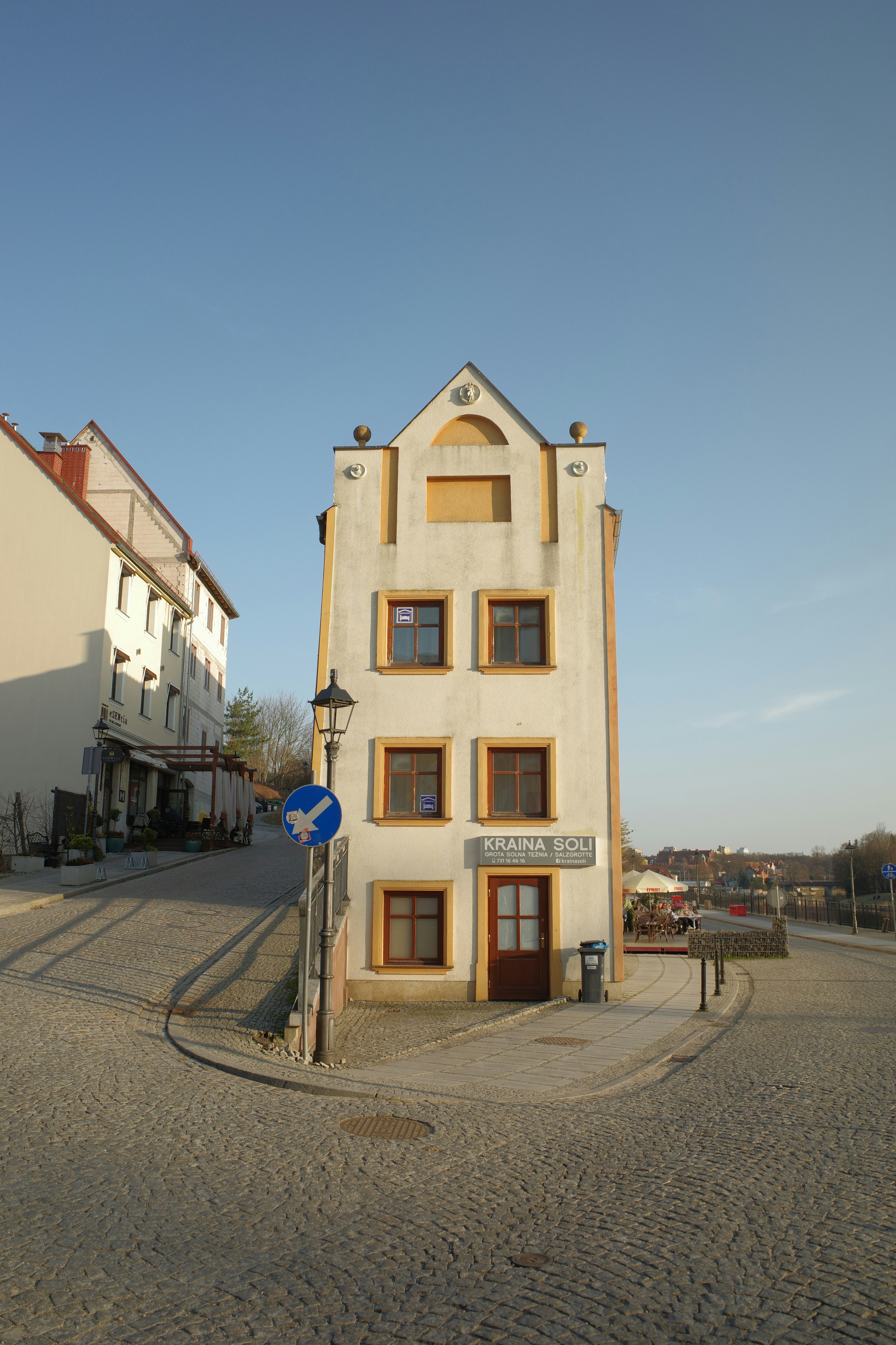Three-Windowed Cornered House on Cobblestone Street