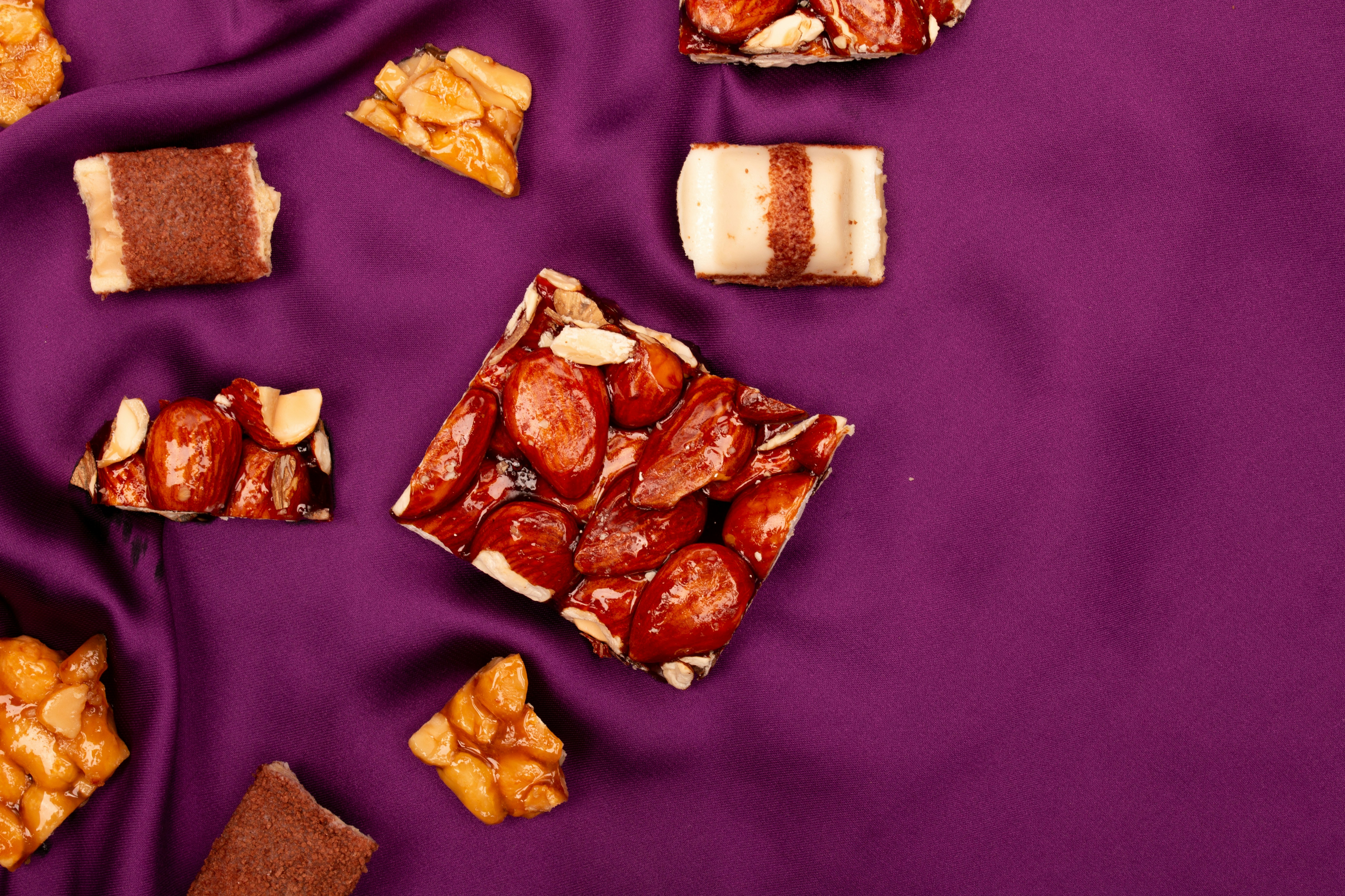 Chunky Candied Nut Squares on Plum Velvet