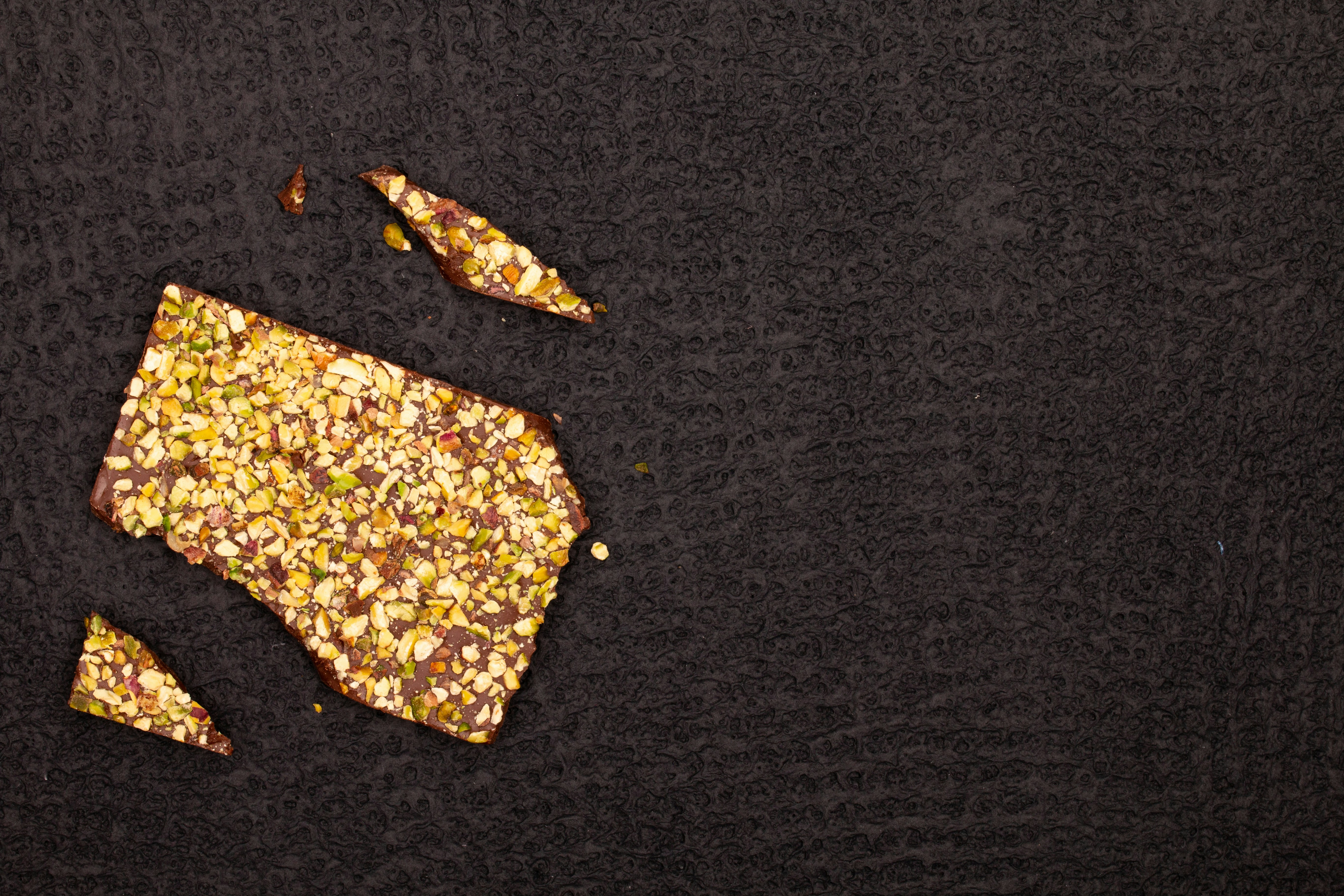 Fragmented Crunch: Sesame-Walnut Chip on a Matte Surface