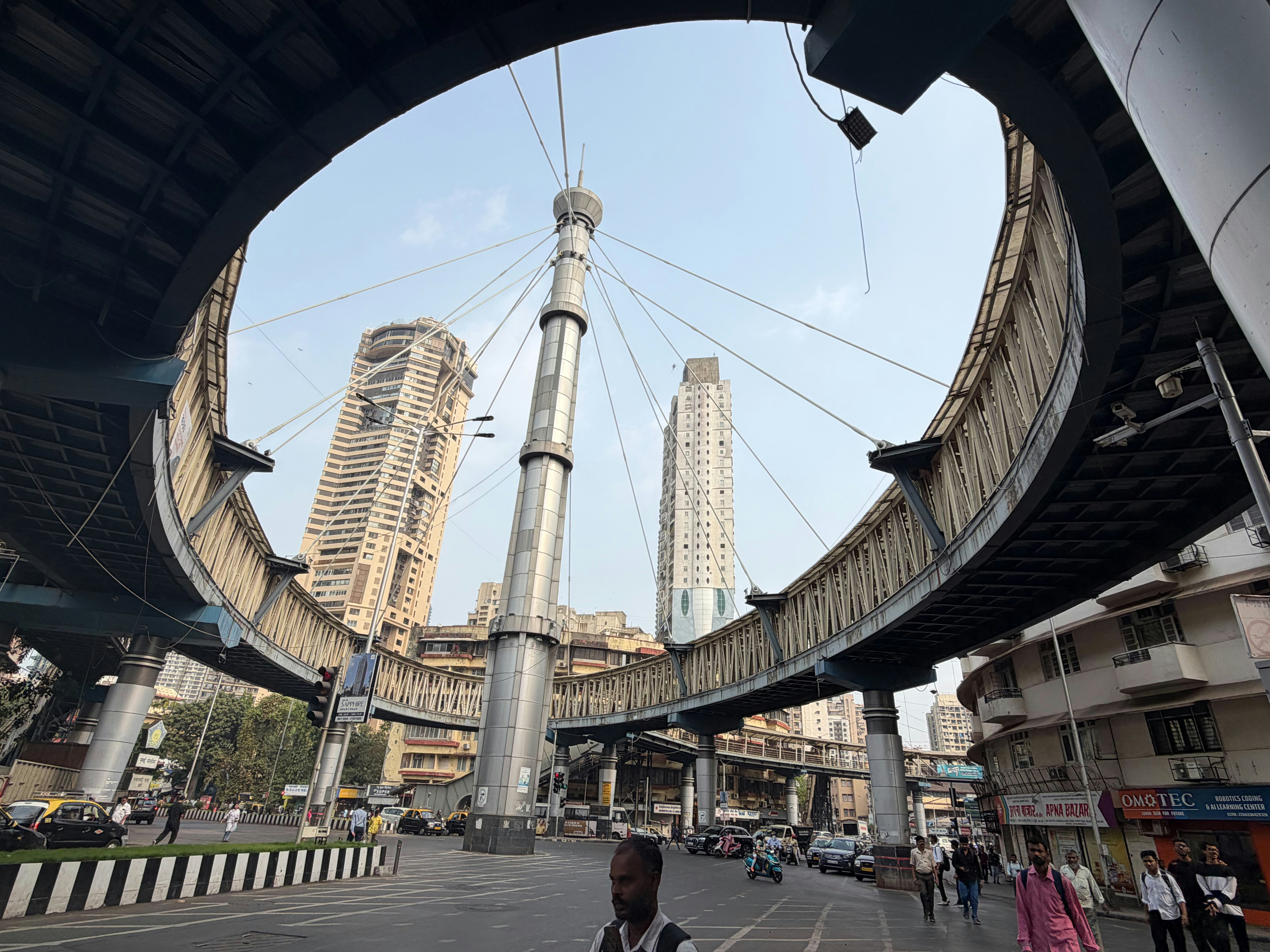 Urban Skyway Curve: Cityscape Framed Under a Suspended Ring