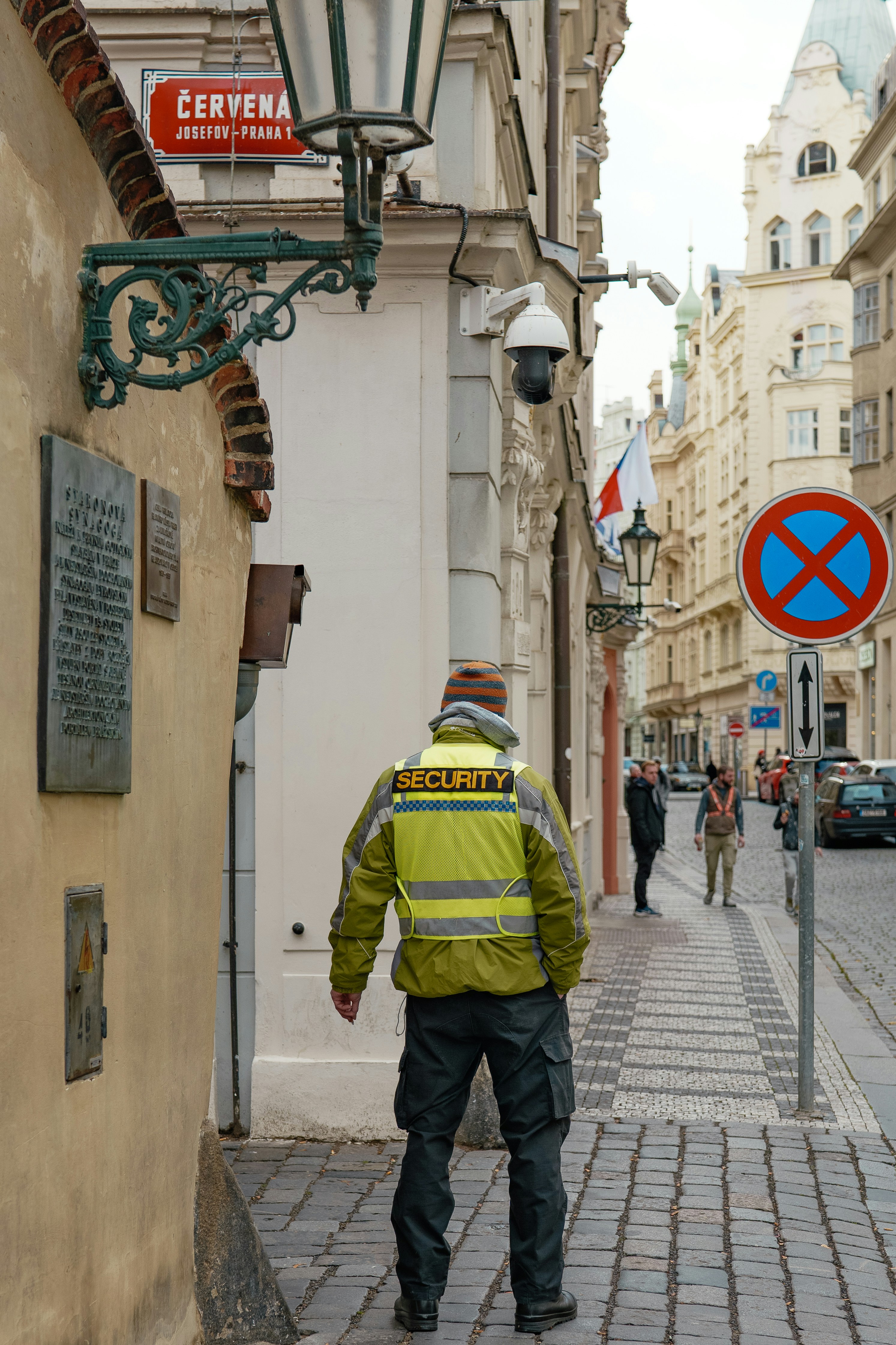 Security Guard in a Narrow European Street