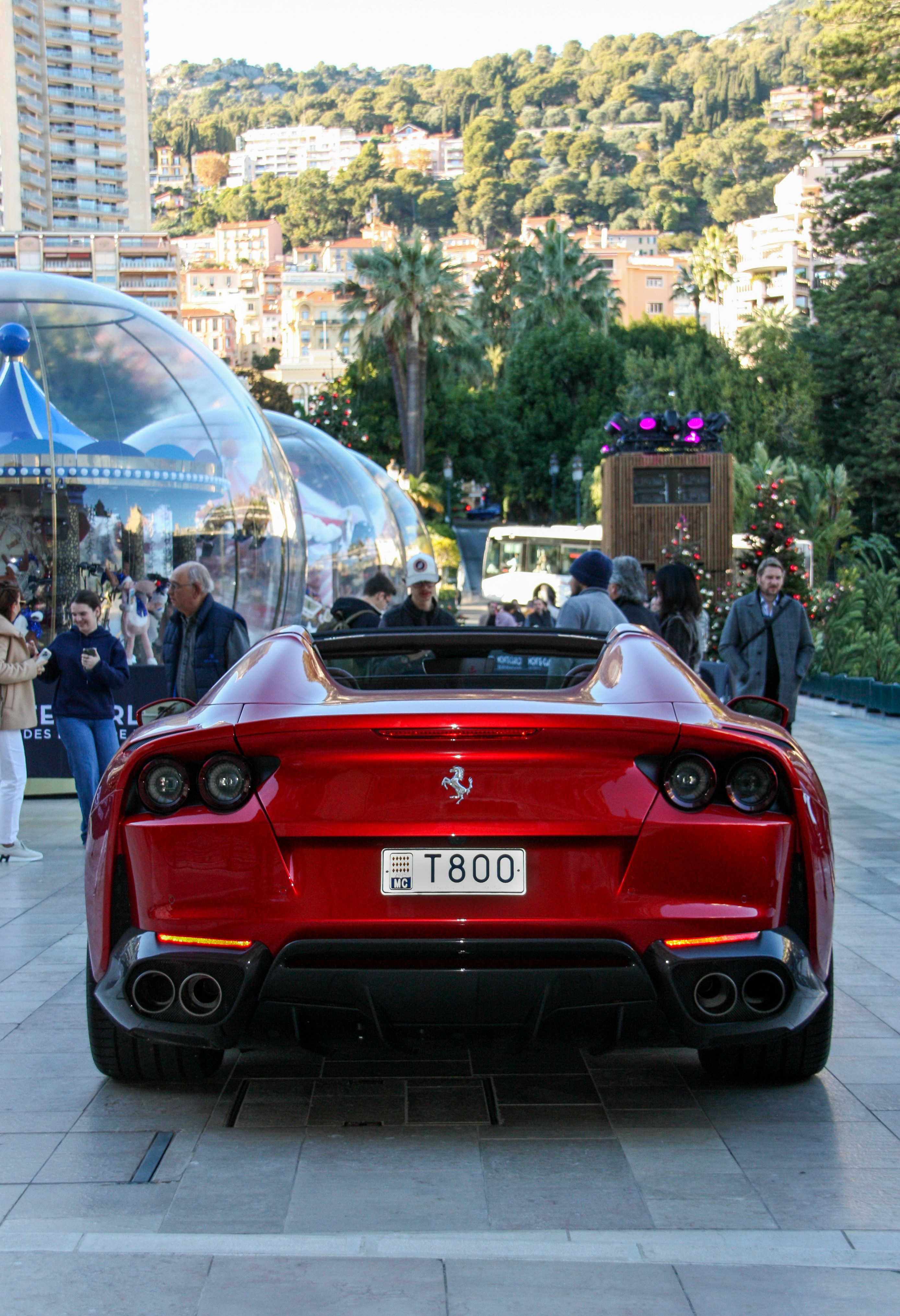 Cherry Red Ferrari with Cityscape Backdrop