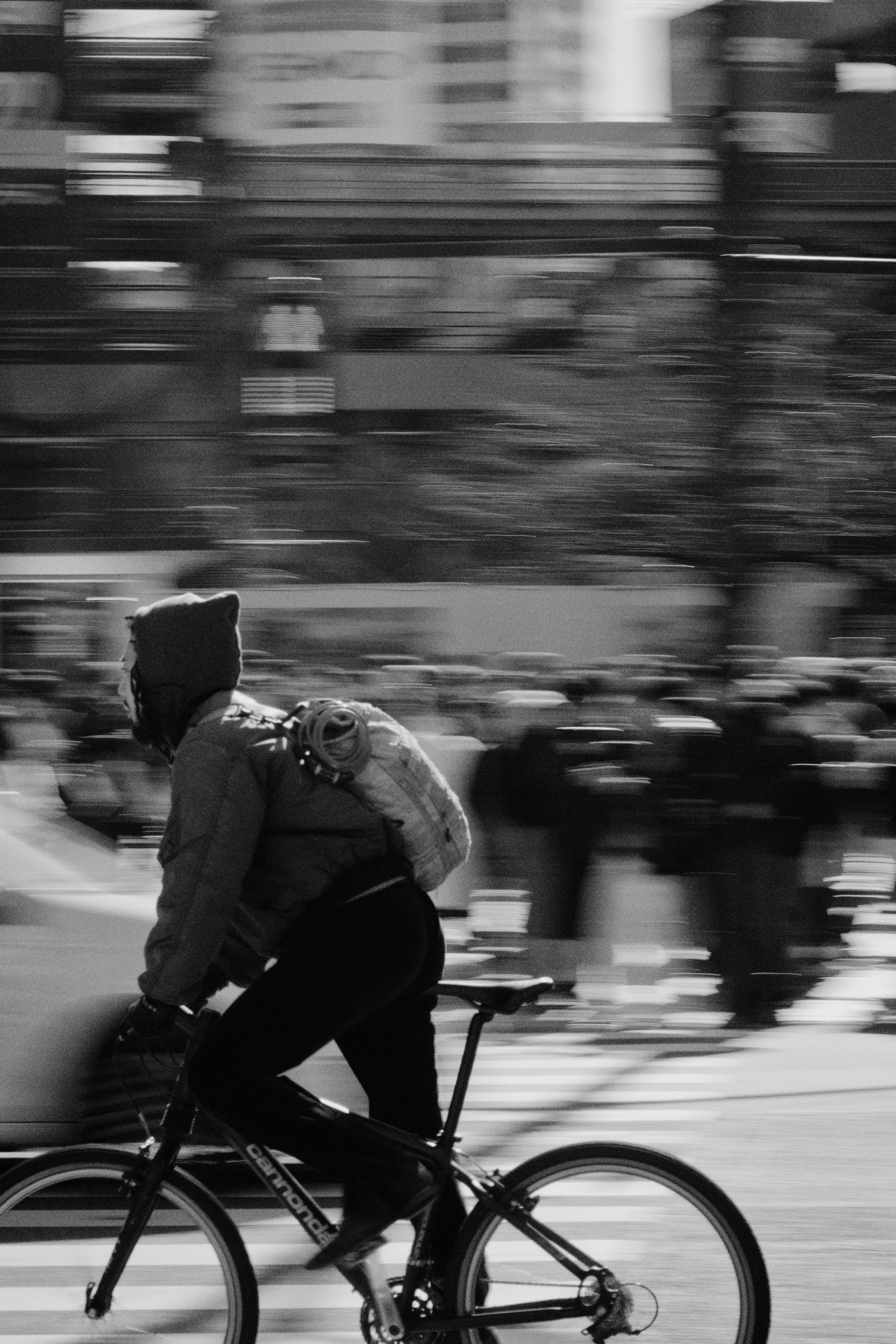 Urban Blur: Cyclist in Motion Through a Crowded City Scene