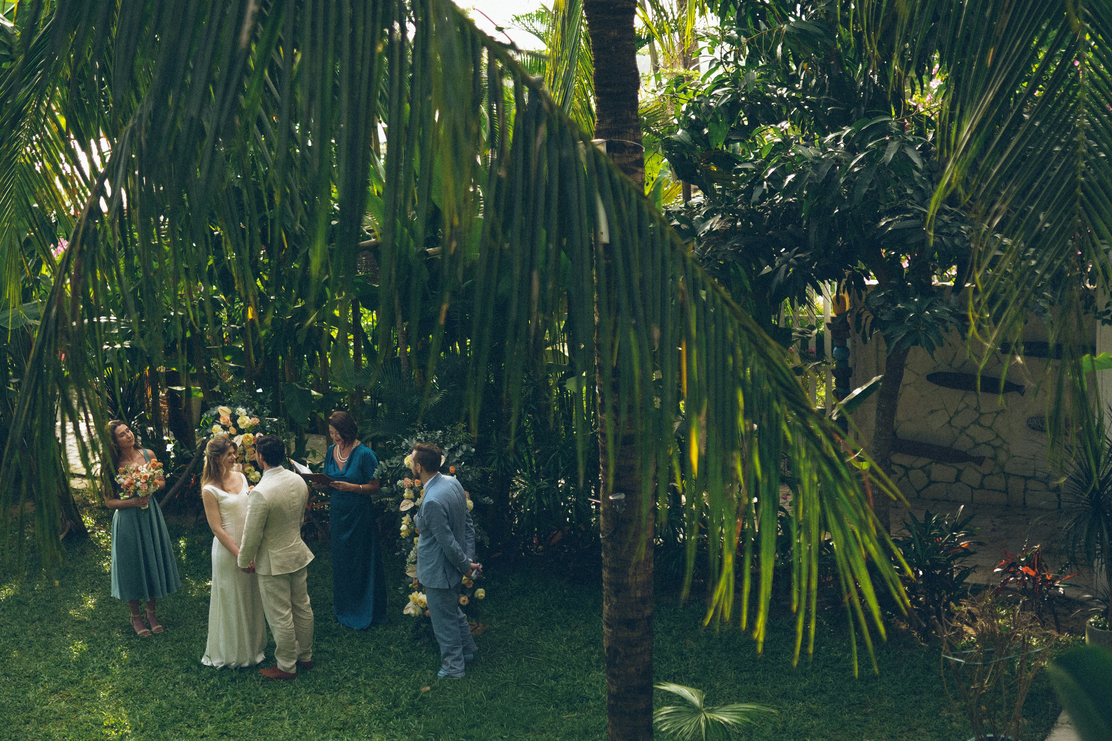 Tropical Garden Ceremony Under a Veil of Fronds