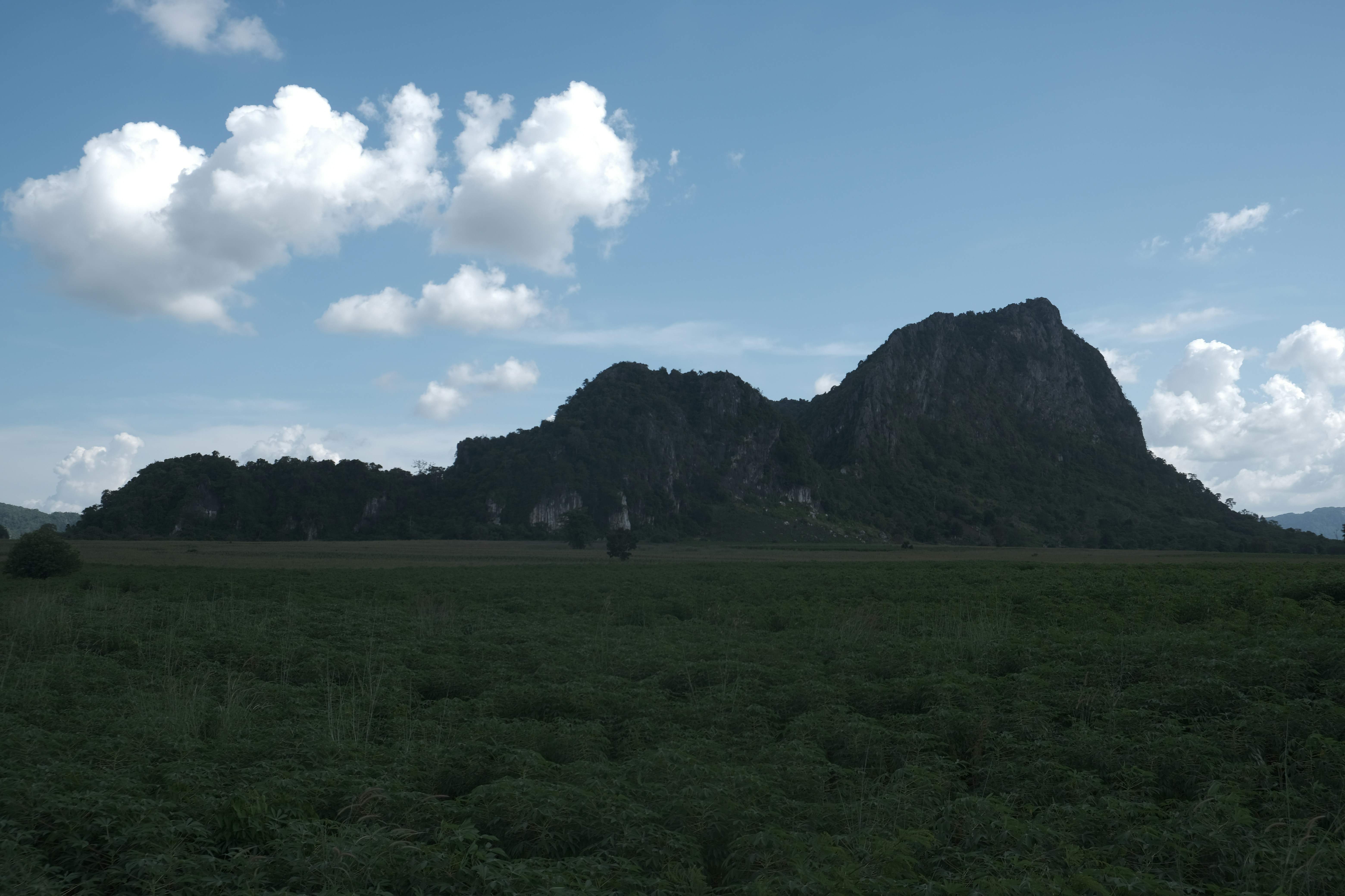 Limestone Ridge Across a Quiet Plain at Dusk