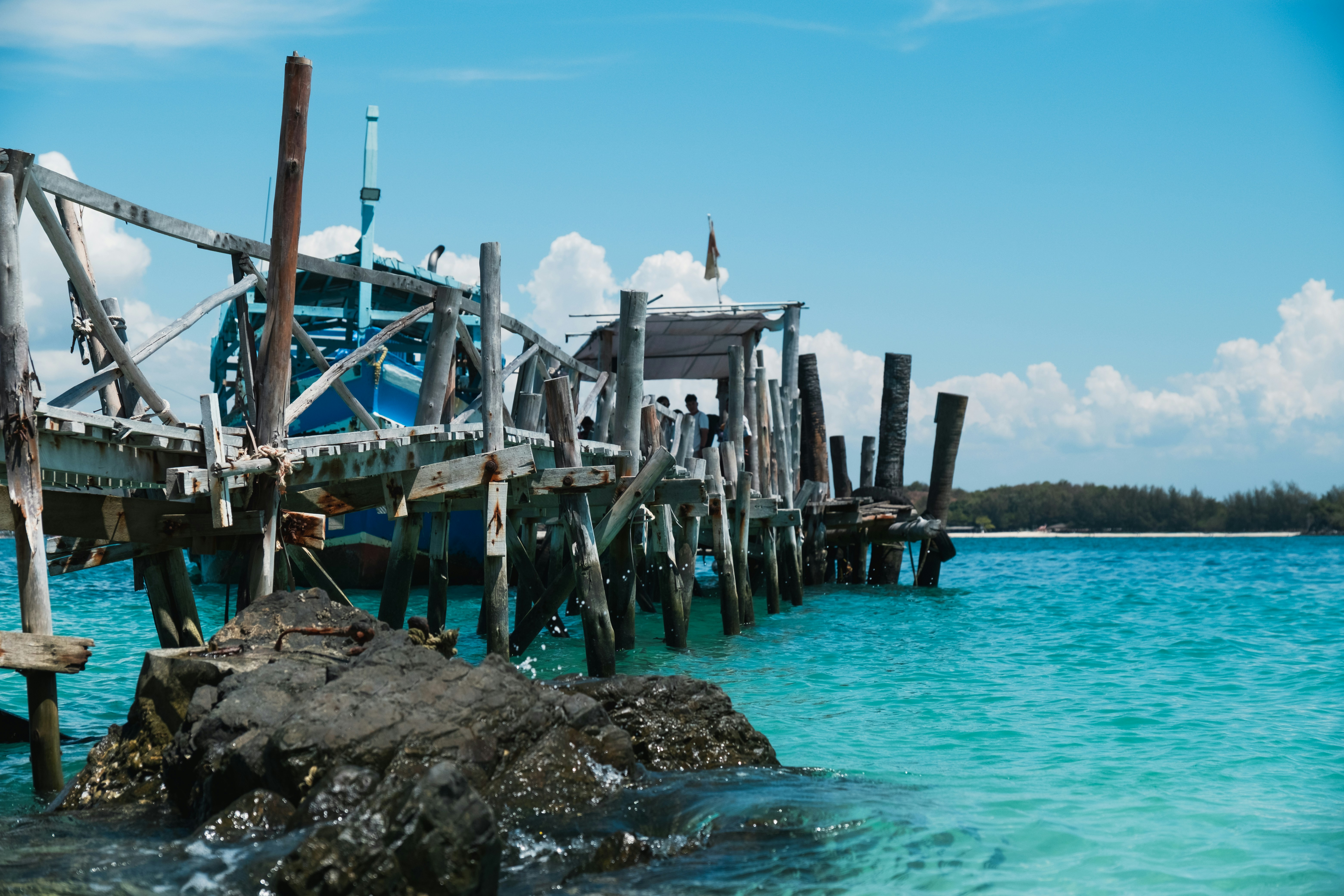 Sunlit Pier Reaches into Turquoise Seas