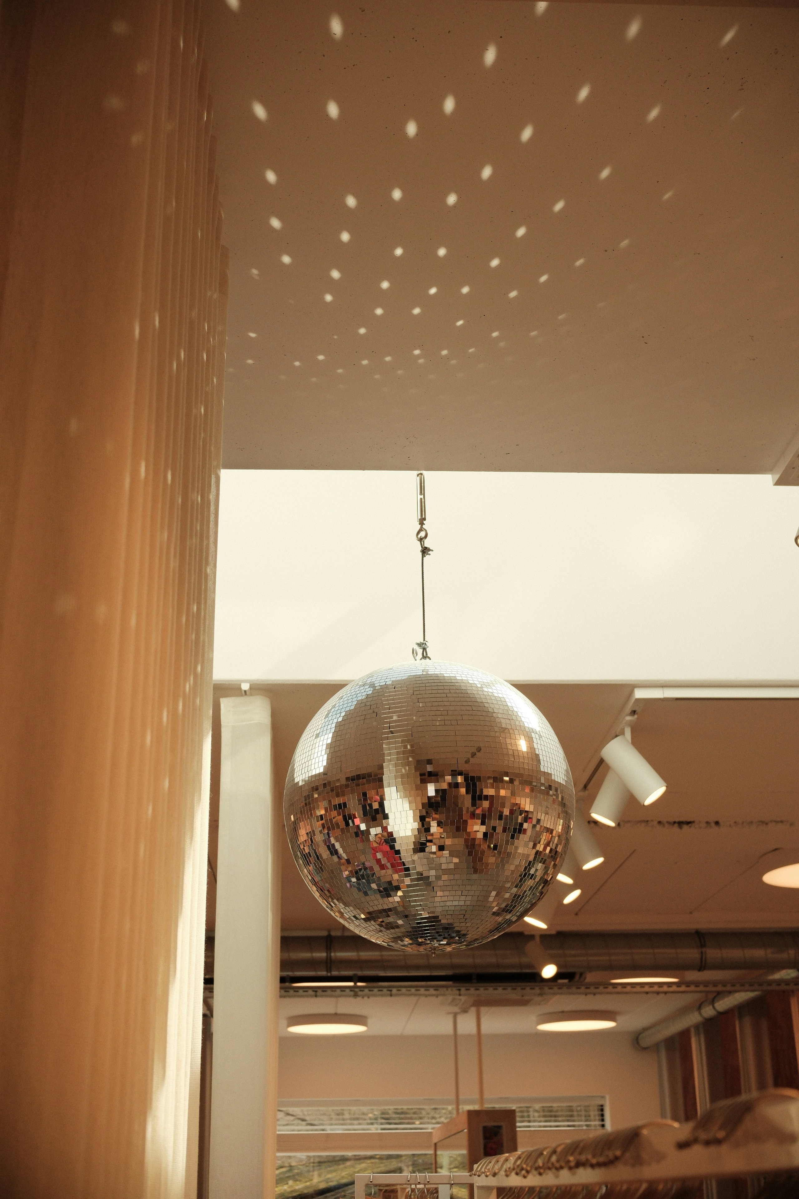 Disco Ball in Soft Room: Reflections and Quiet Echoes