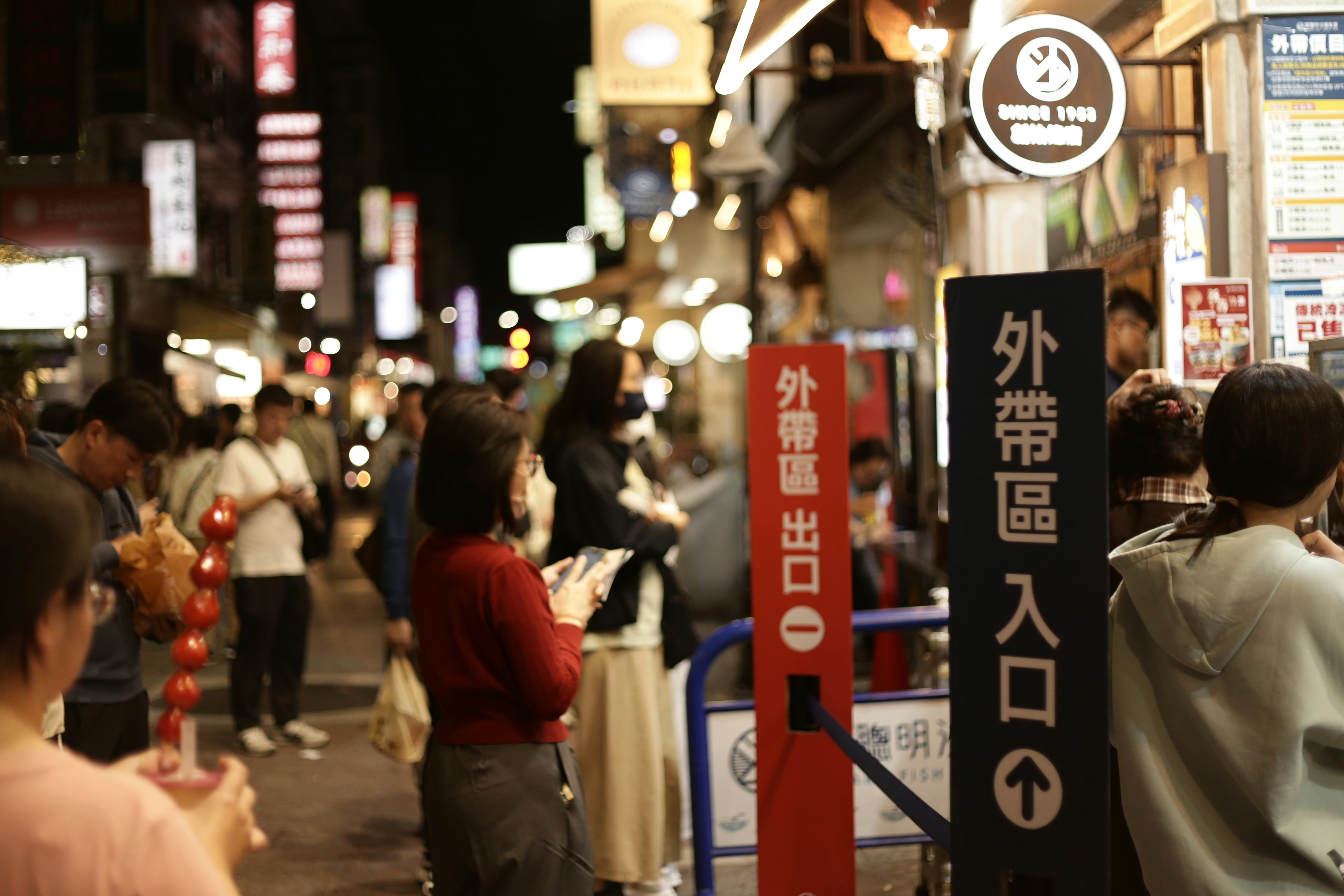 Neon Crowd at a Bustling Night Market