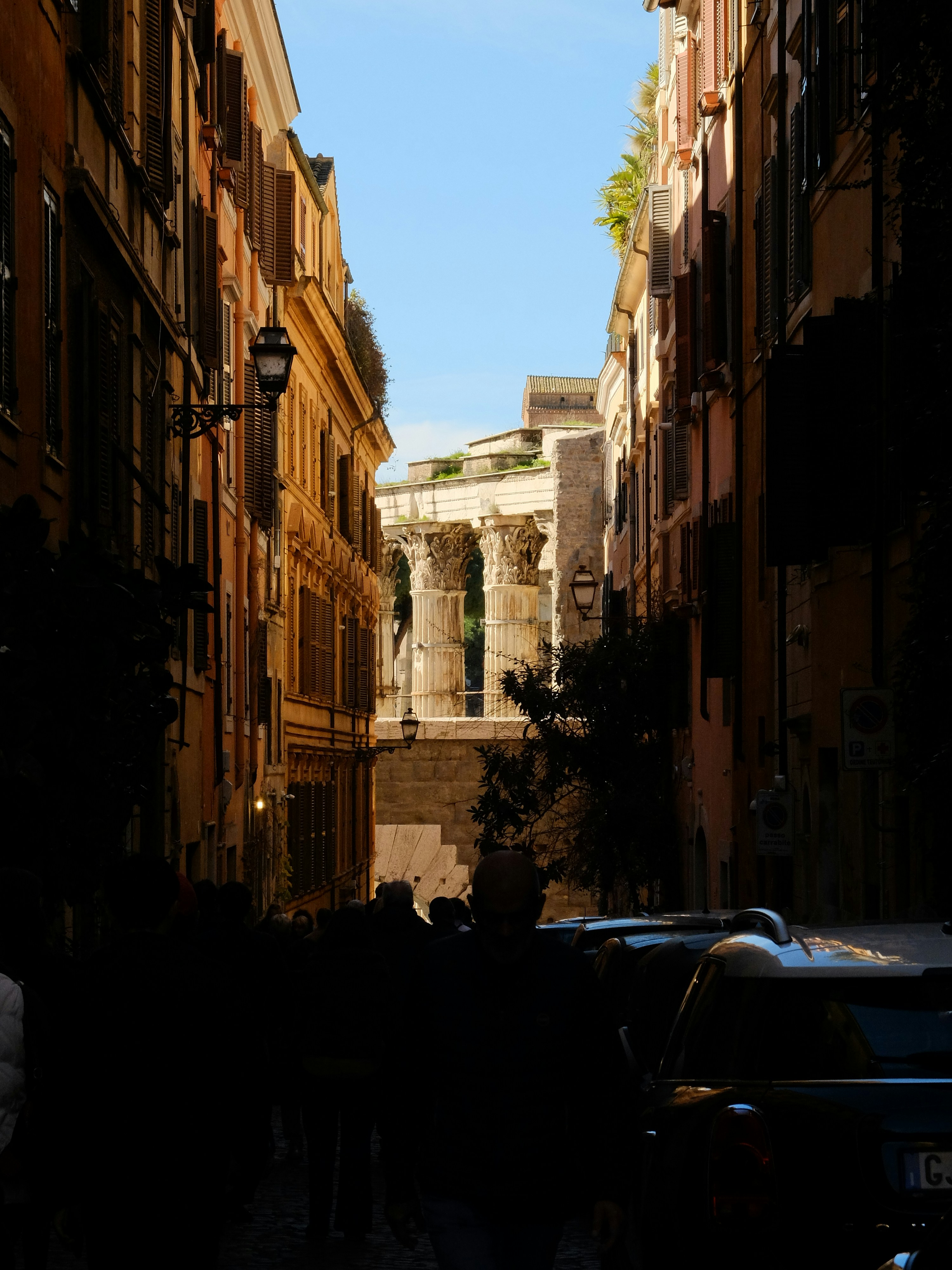 Sunlit Archway Between Narrow Calle Streets