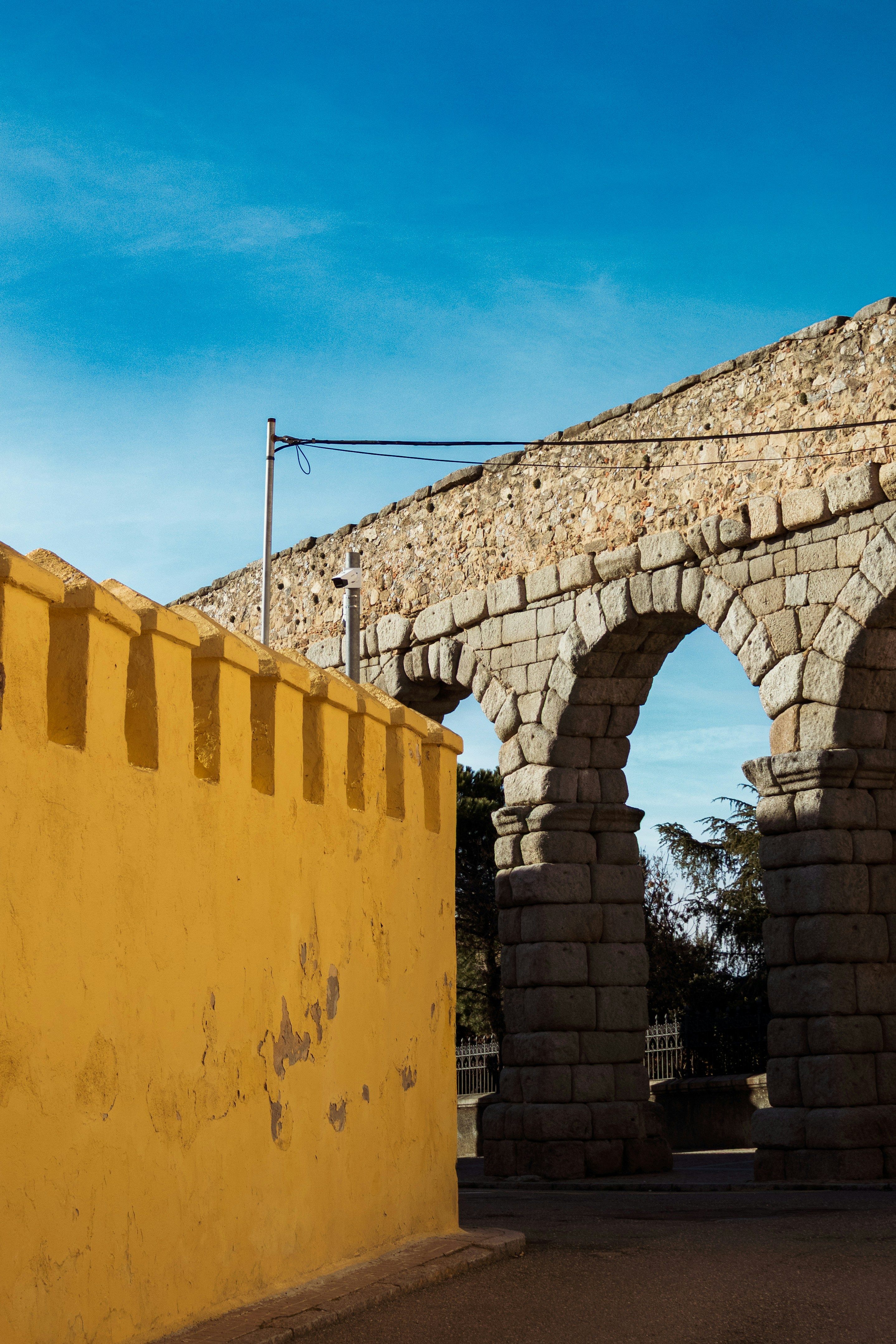 Golden Wall and Ancient Arches: A Quiet Passage Under Stone Roof