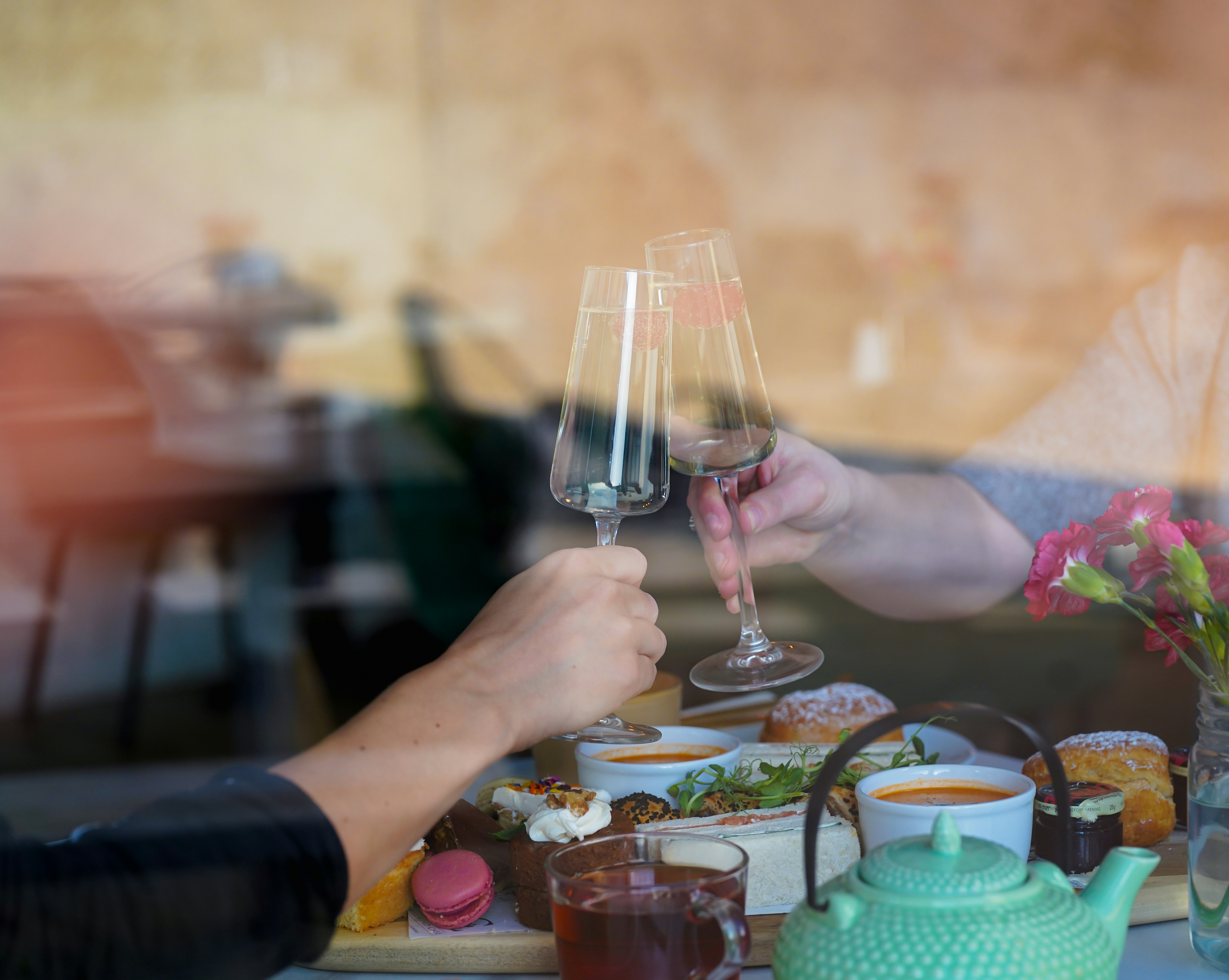 Toasts and Tea: A Shared Moment Over a Festive Spread