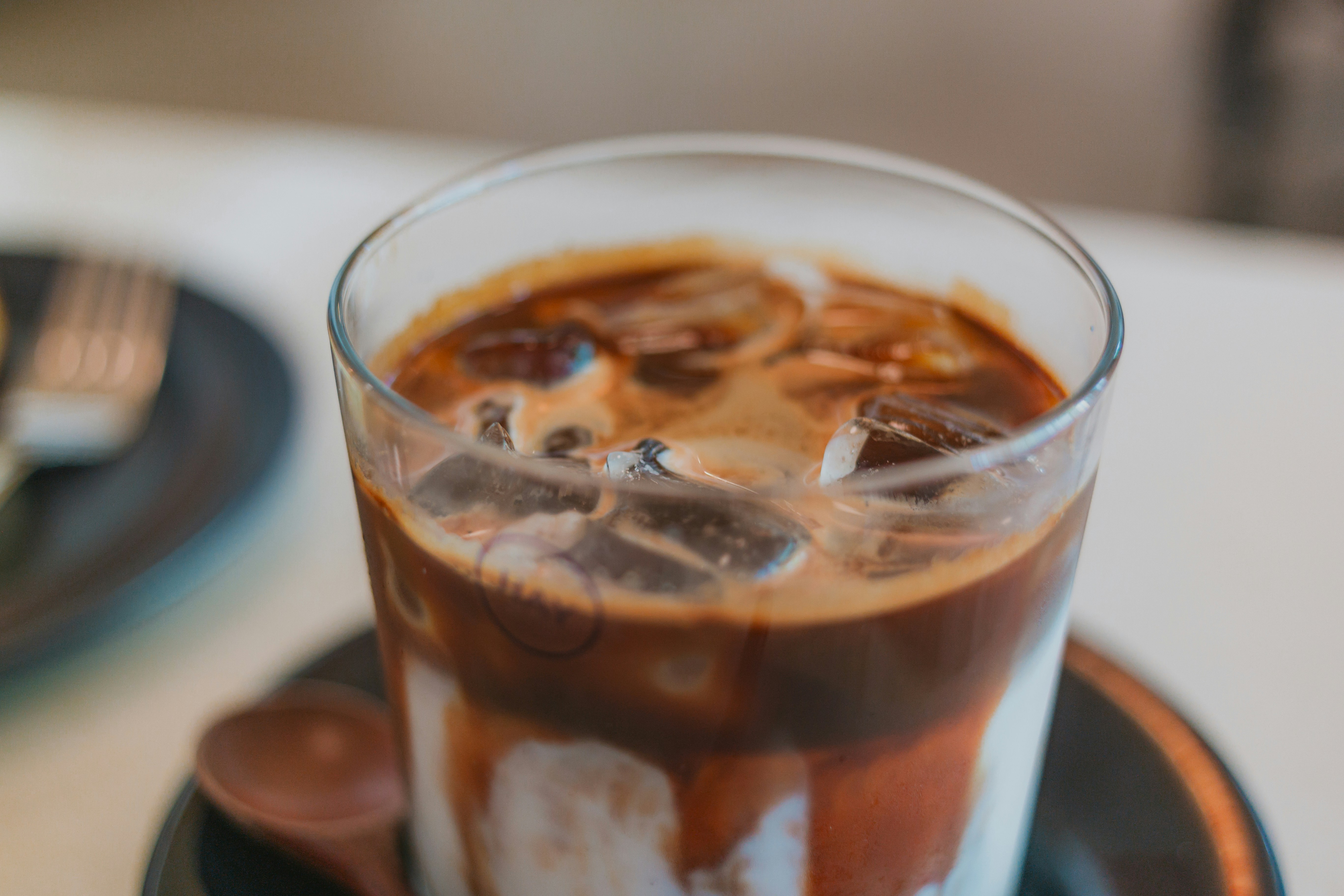 Iced coffee with milk and ice cubes