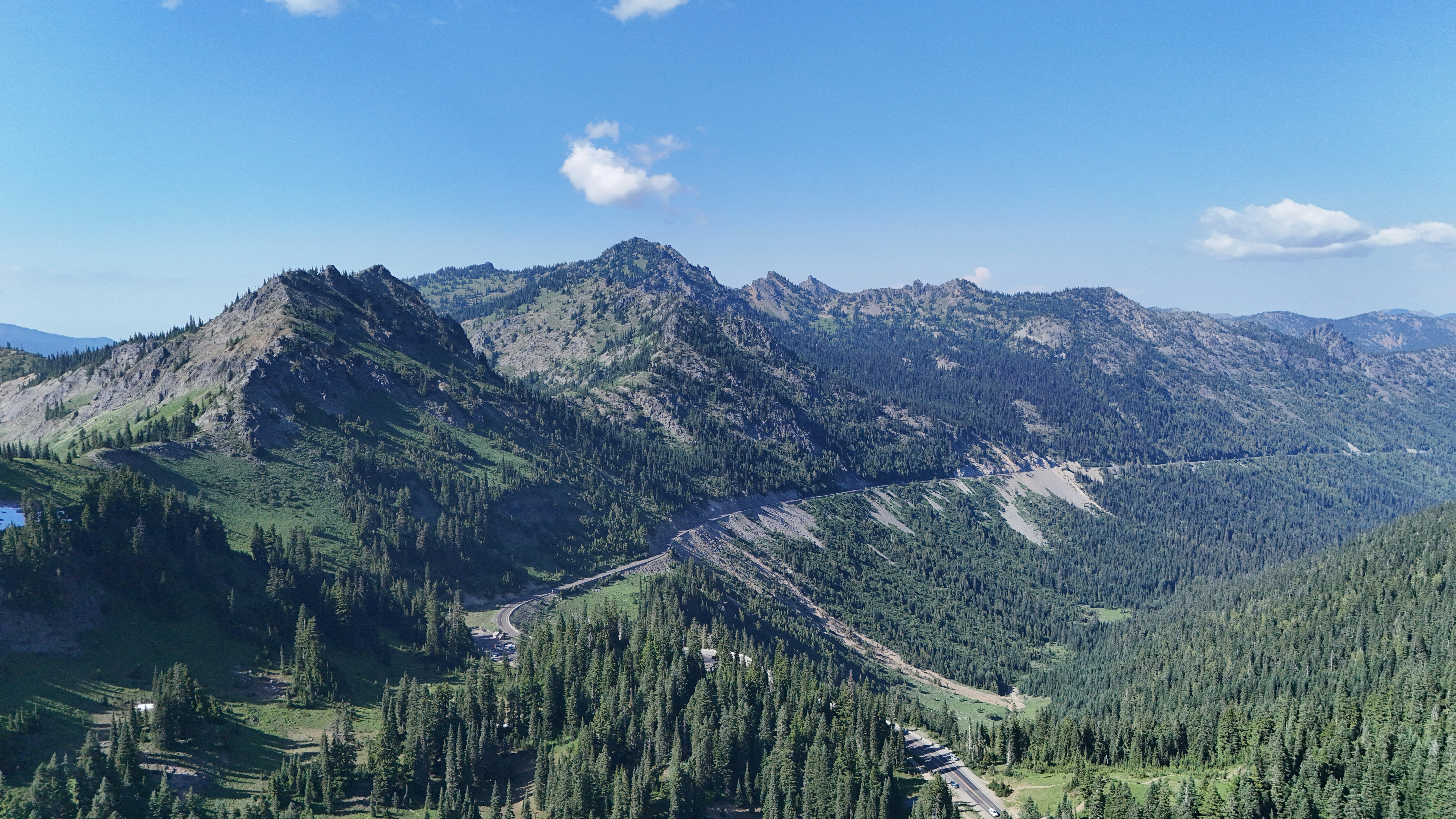 Aerial Cascade: Alpine ridge under a crisp cobalt sky
