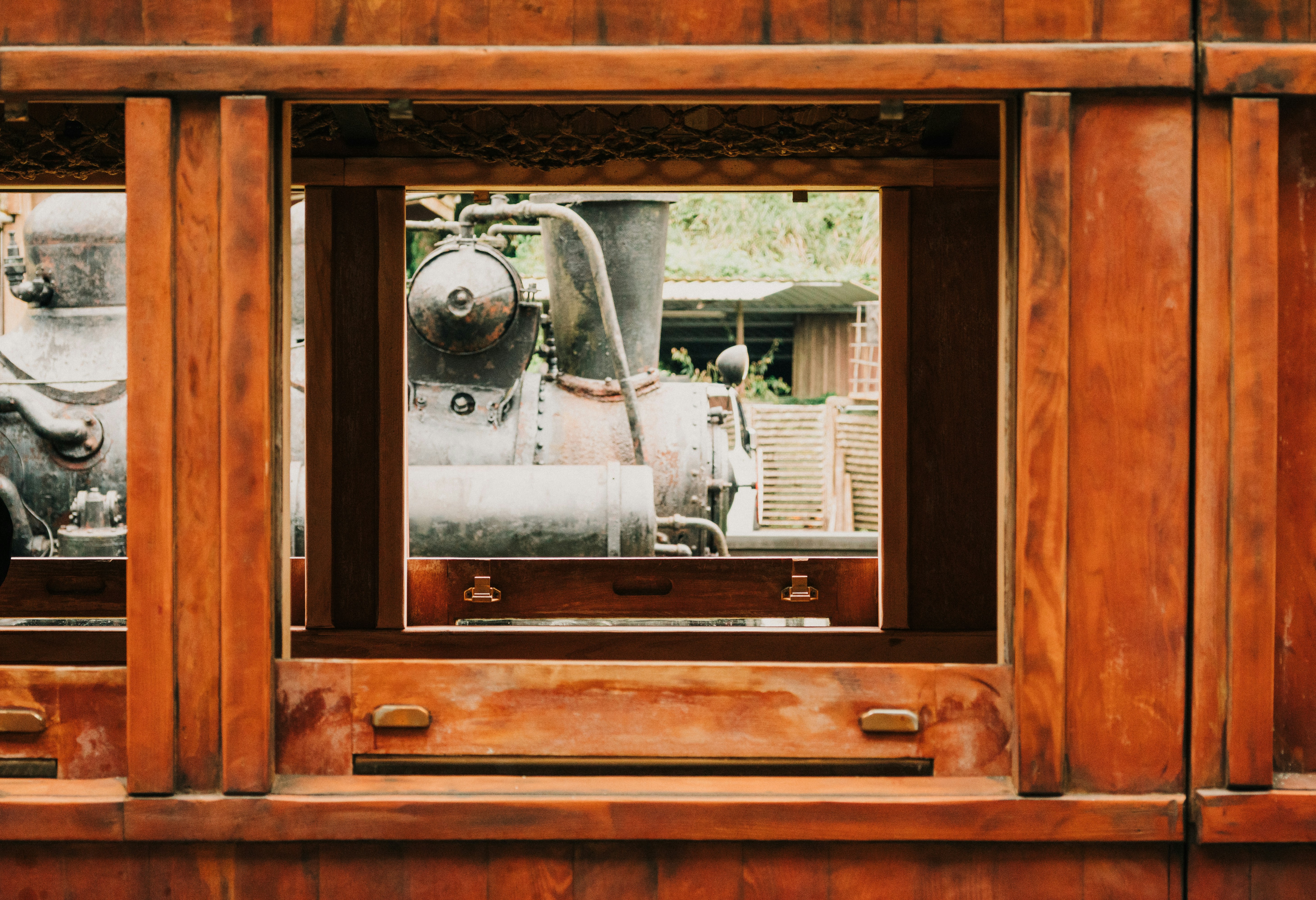 Through the Wooden Frame: An Industrial Gable Peering at Machinery