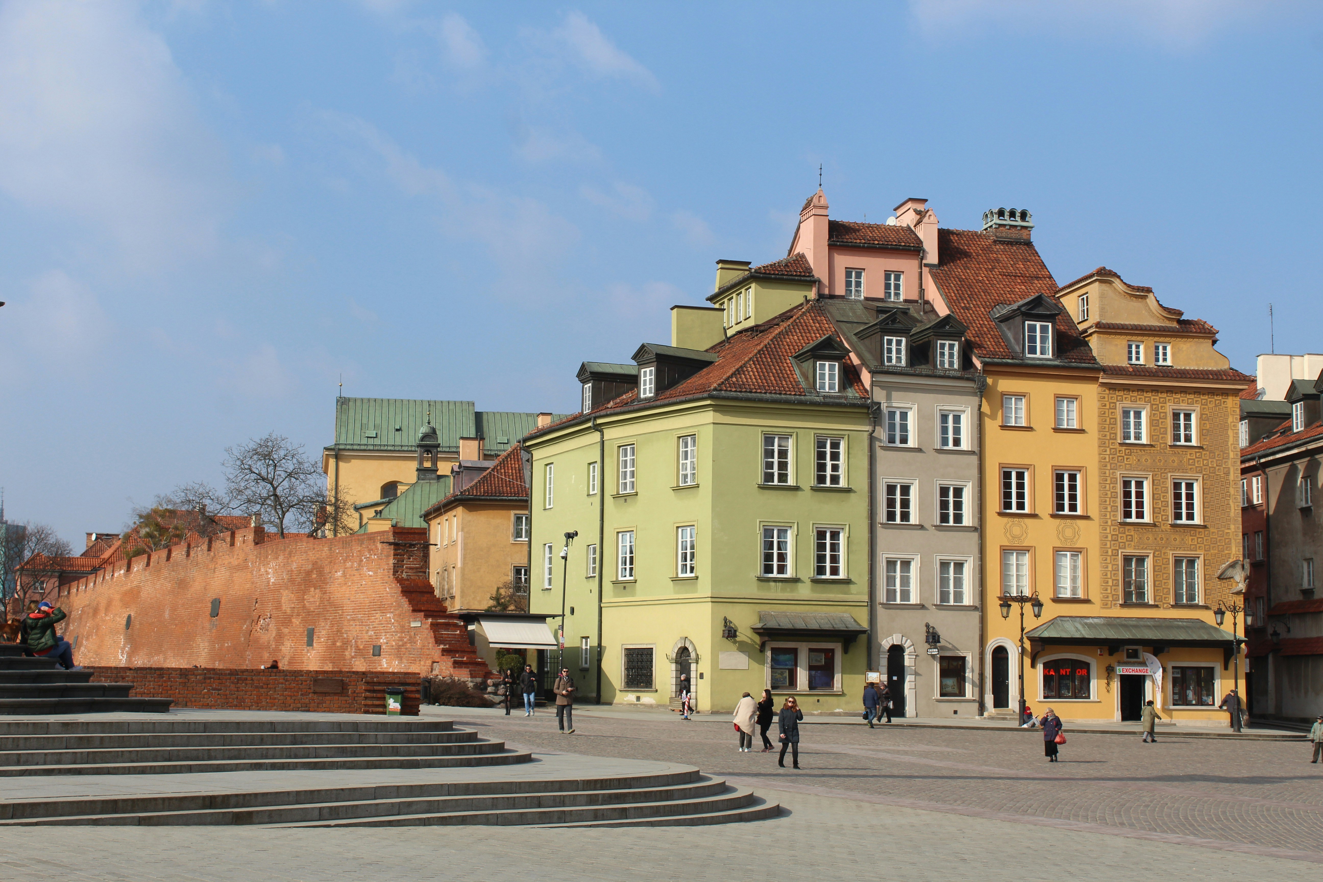 Pastel Facades on a Sunlit Polish Market Square