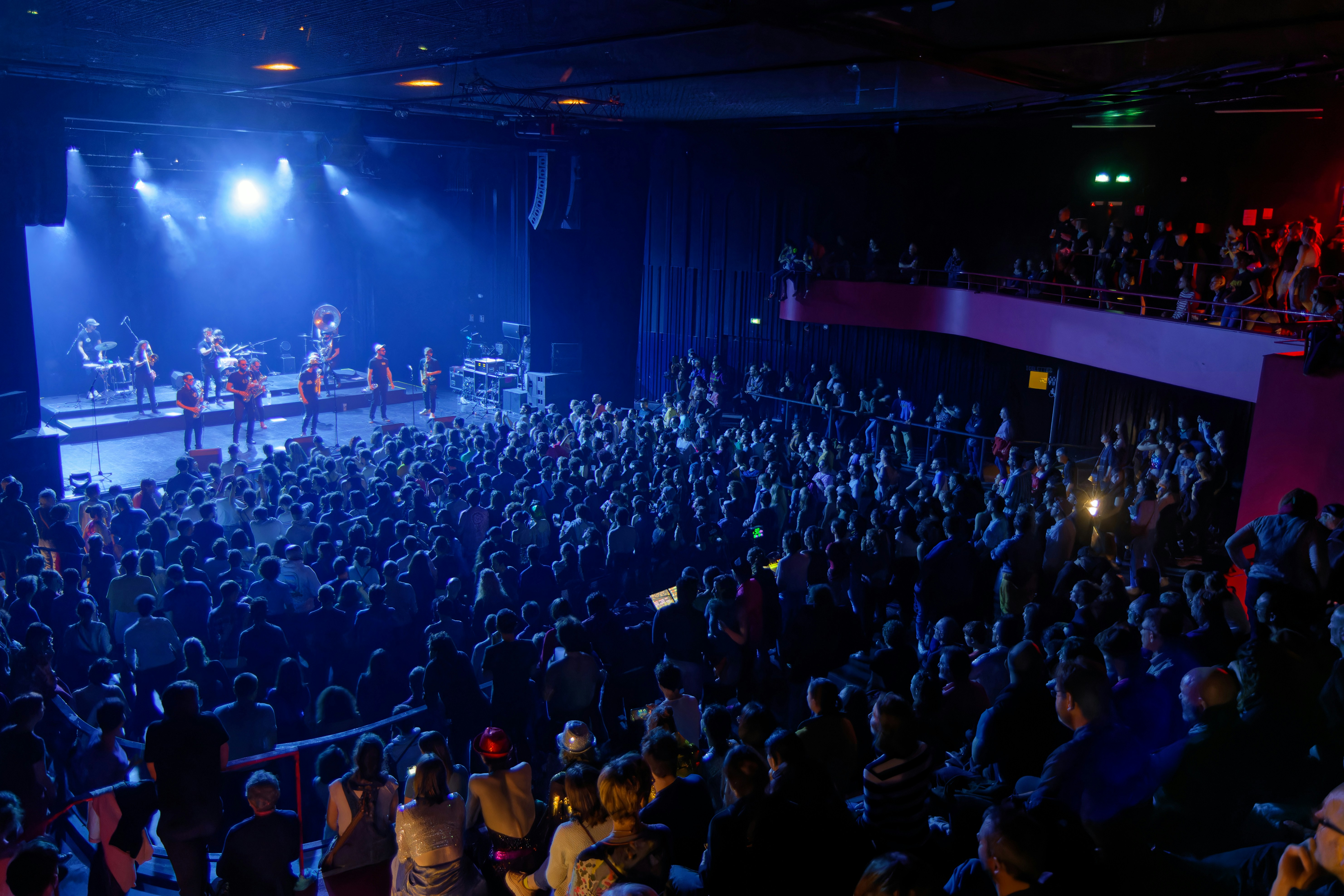 Stage Lights and Crowd Pulse: A Live Concert in a Dim Arena