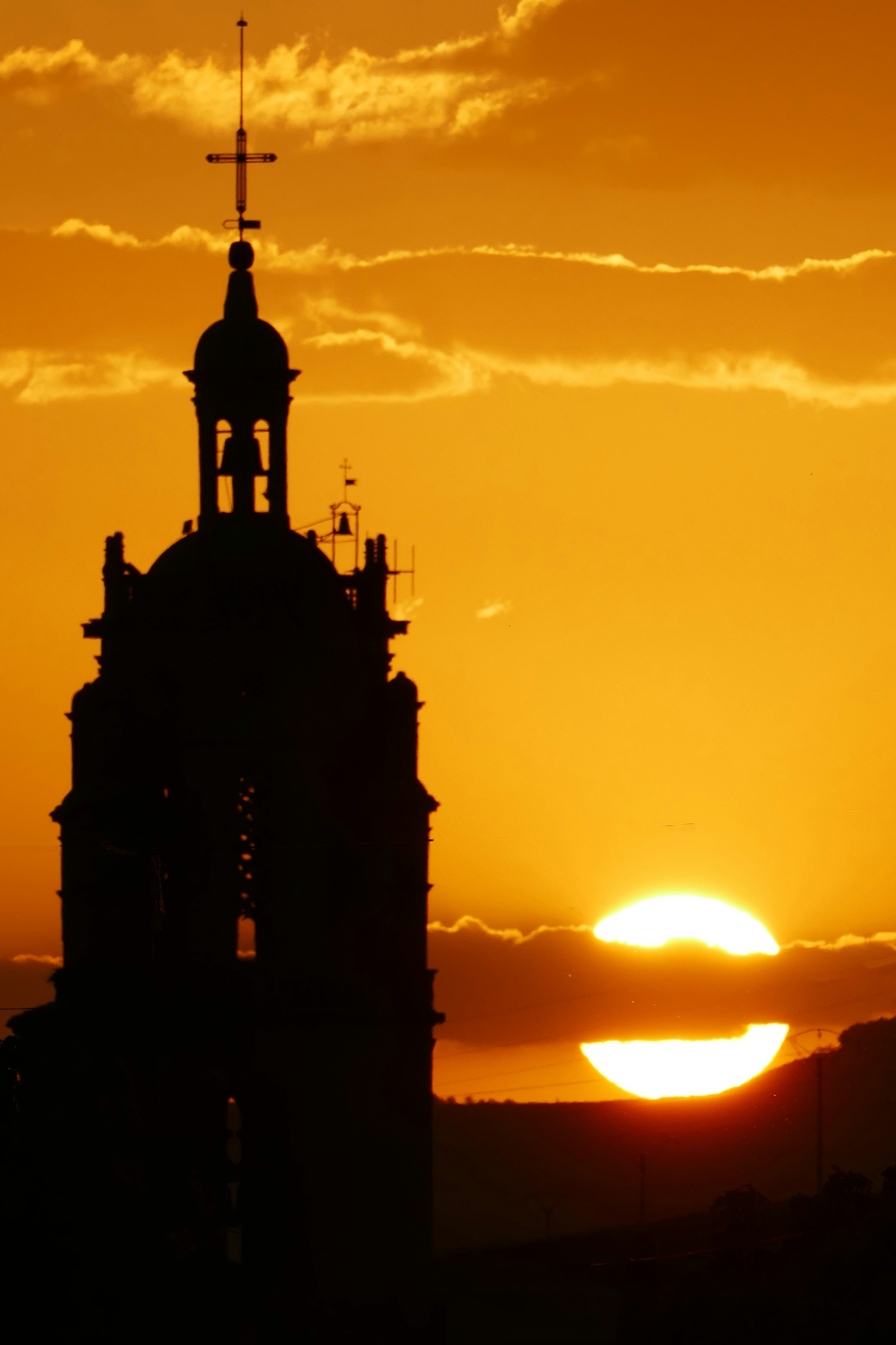 Sunset Silhouette over a Towered Spire