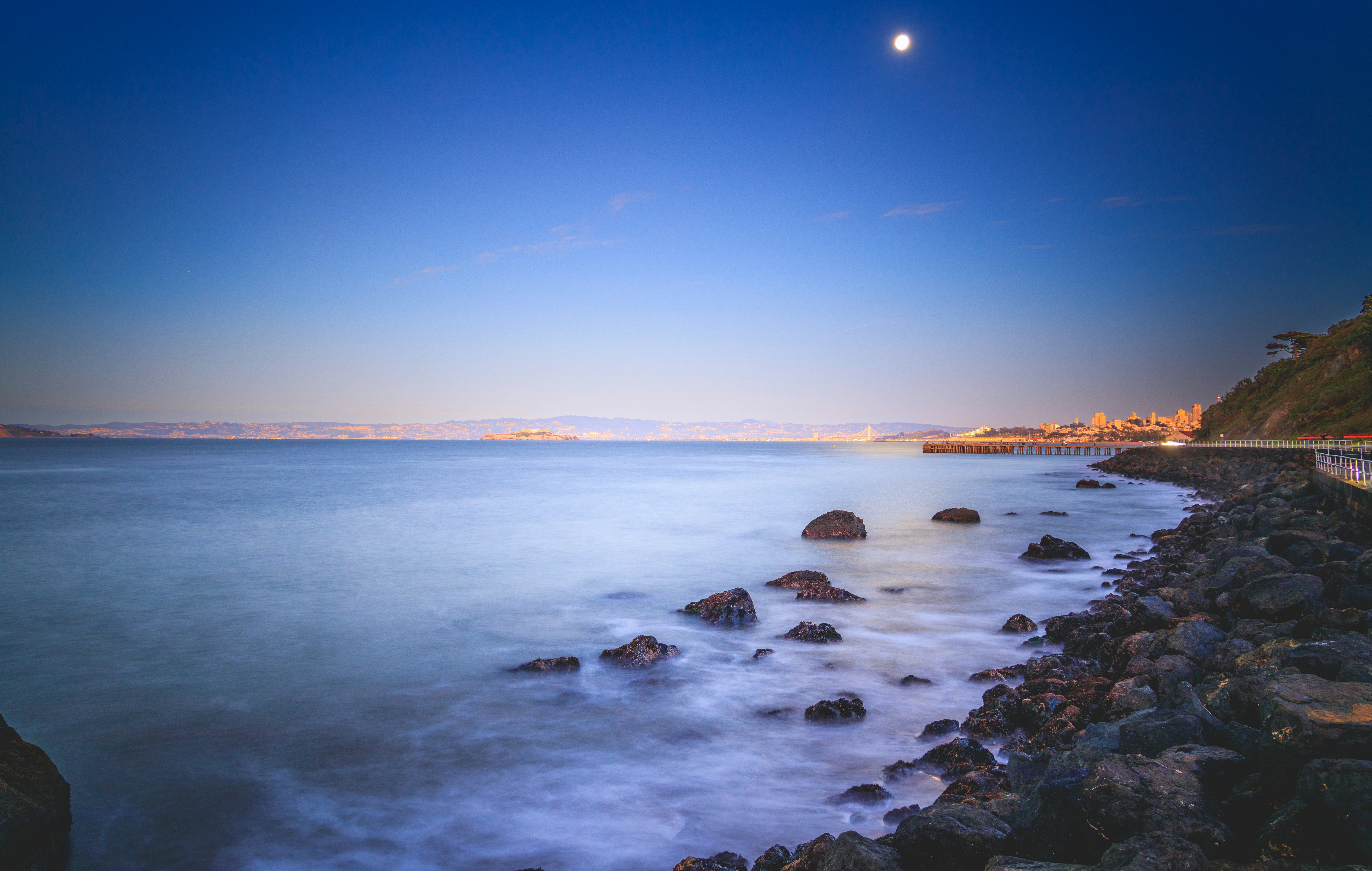 Moonlit Quiet: Coastal Rocks Meet a Velvet Sea
