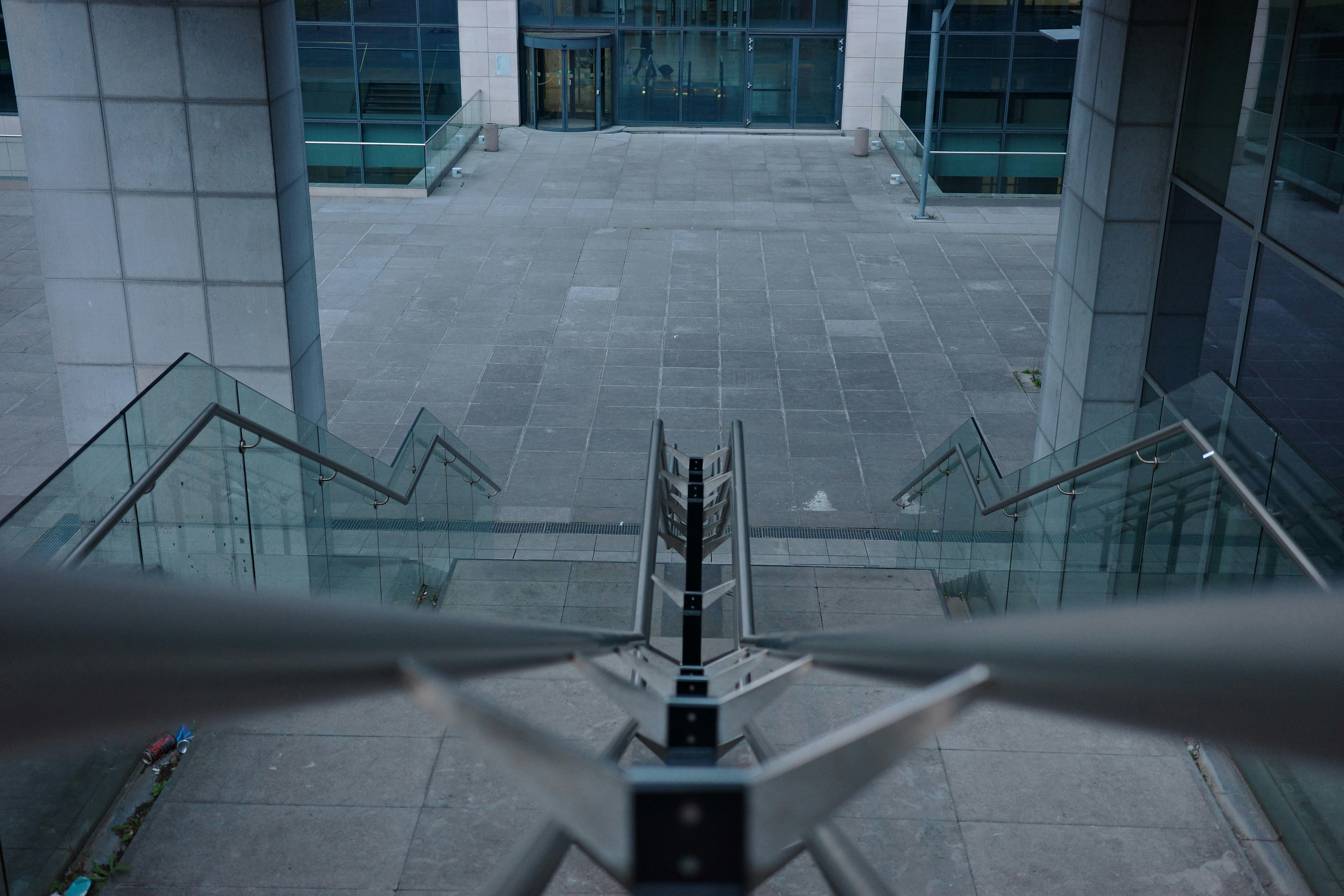 Glass Summit: A Symmetry-Driven Descent through Stairs to a Glass Courtyard