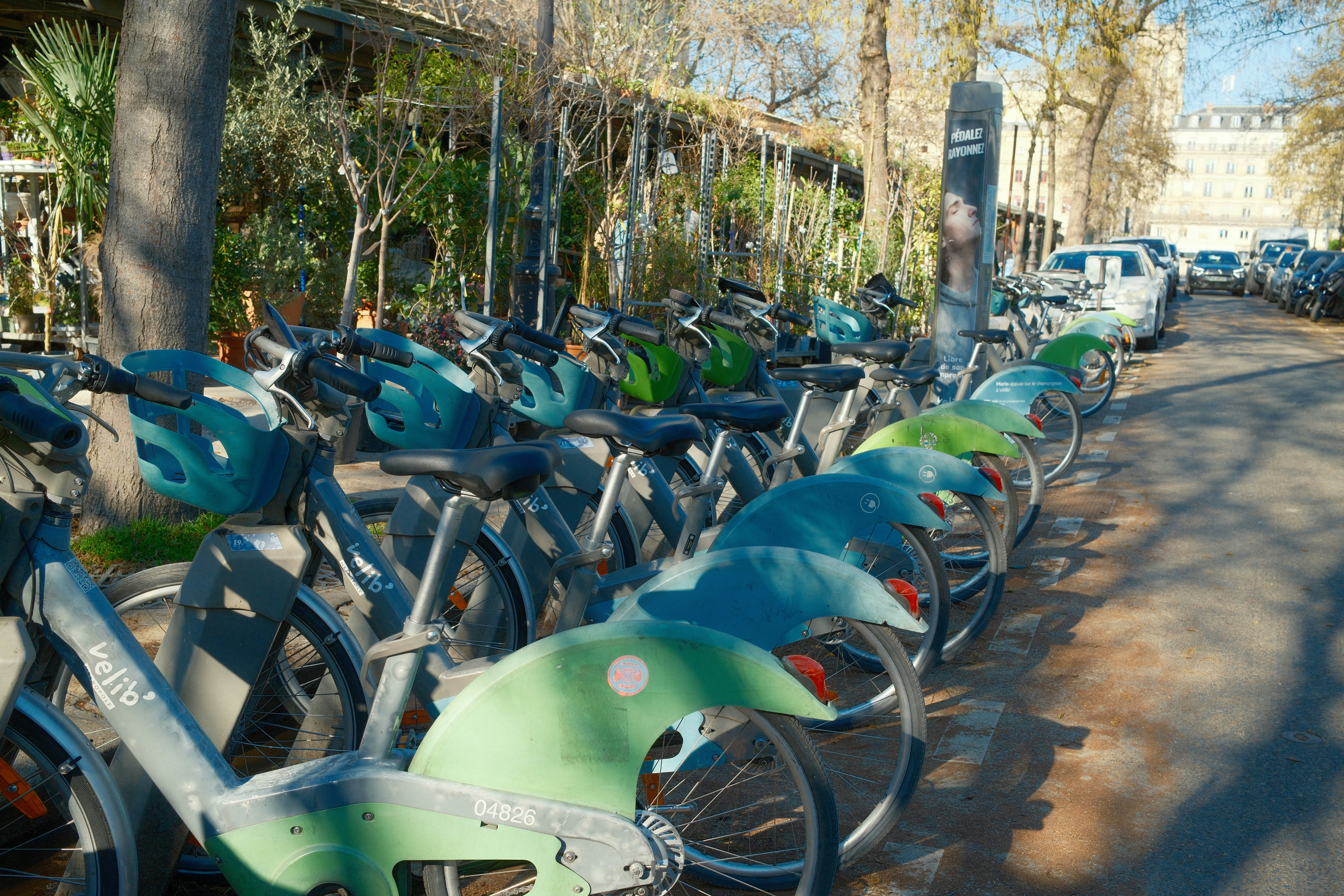 Row of Colorful City Bikes Recharged for a Day in the Sun