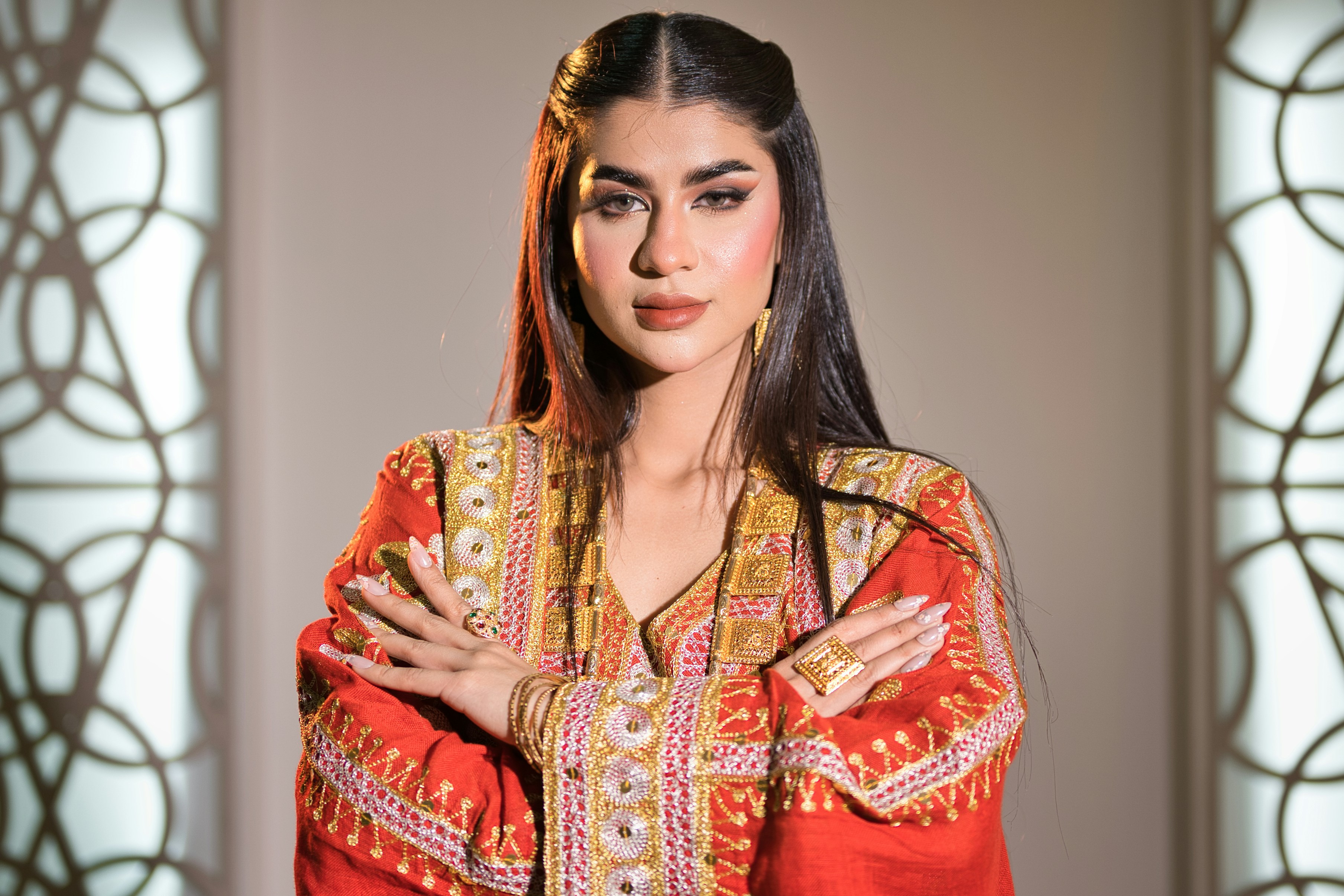 Royal Poise: A Red-Gold Couture Portrait