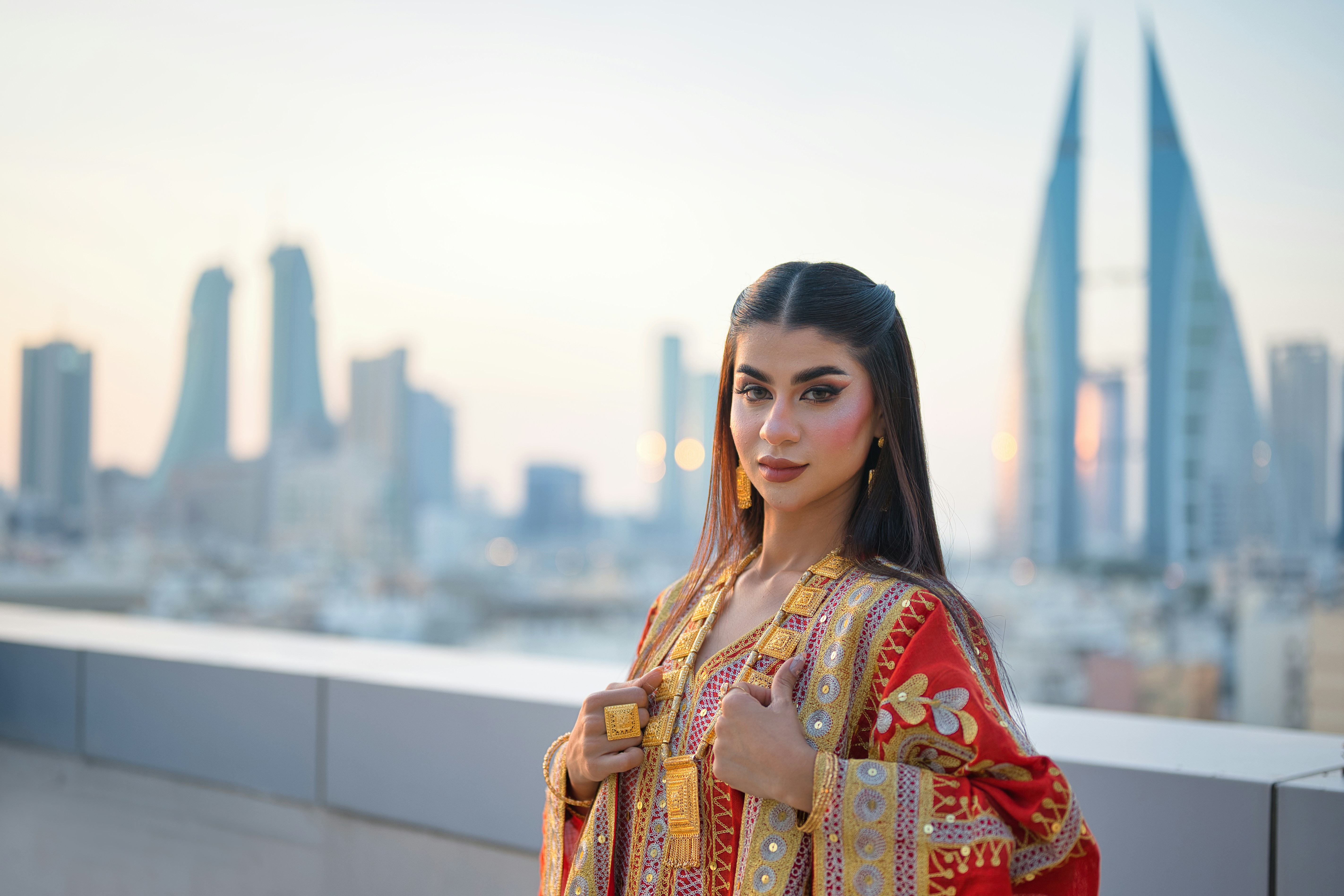 Urban Muse: A Portrait Draped in Patterned Silk Against a Futuristic Skyline
