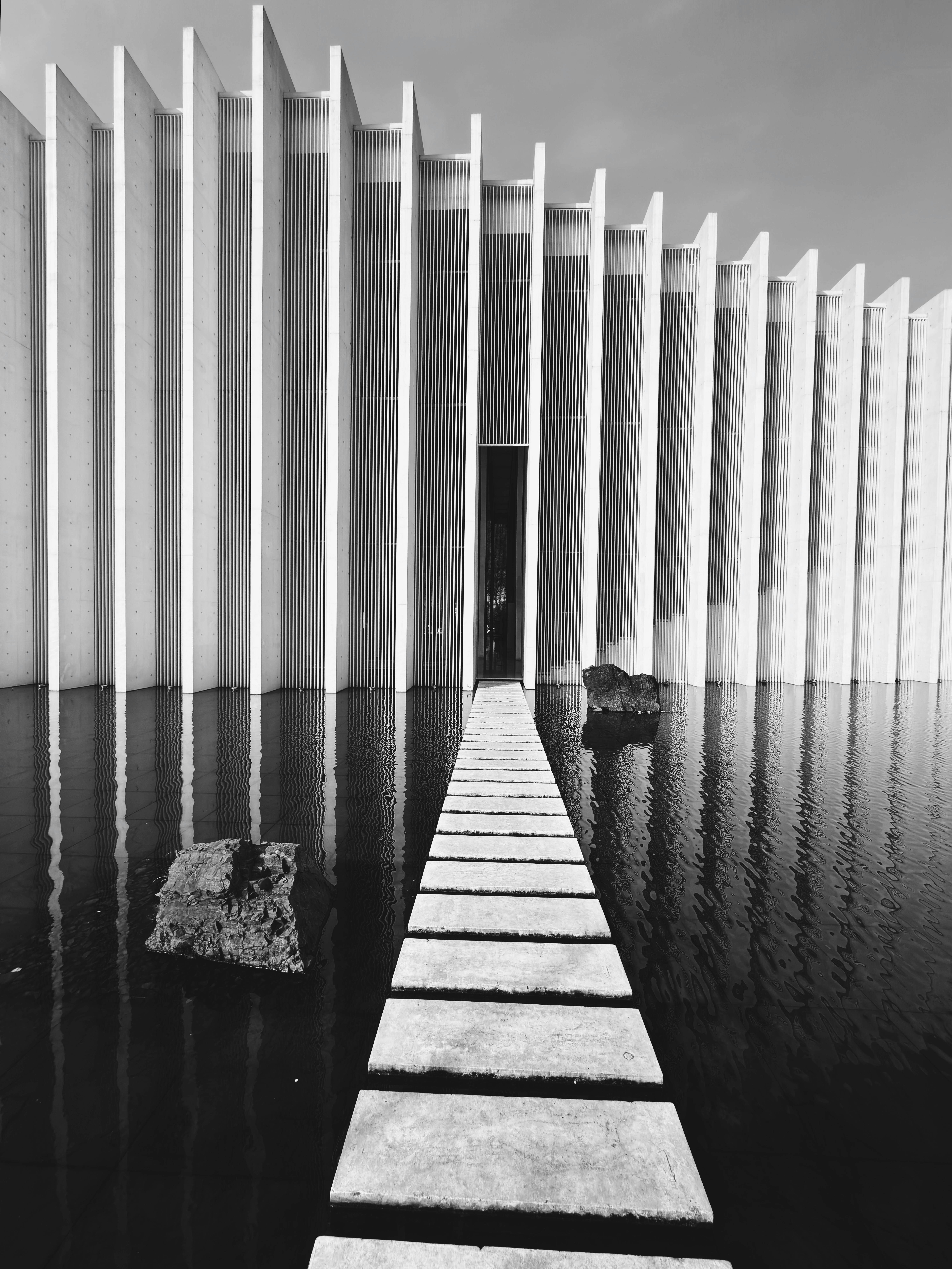 Converging Walkway to a Monolithic Facade