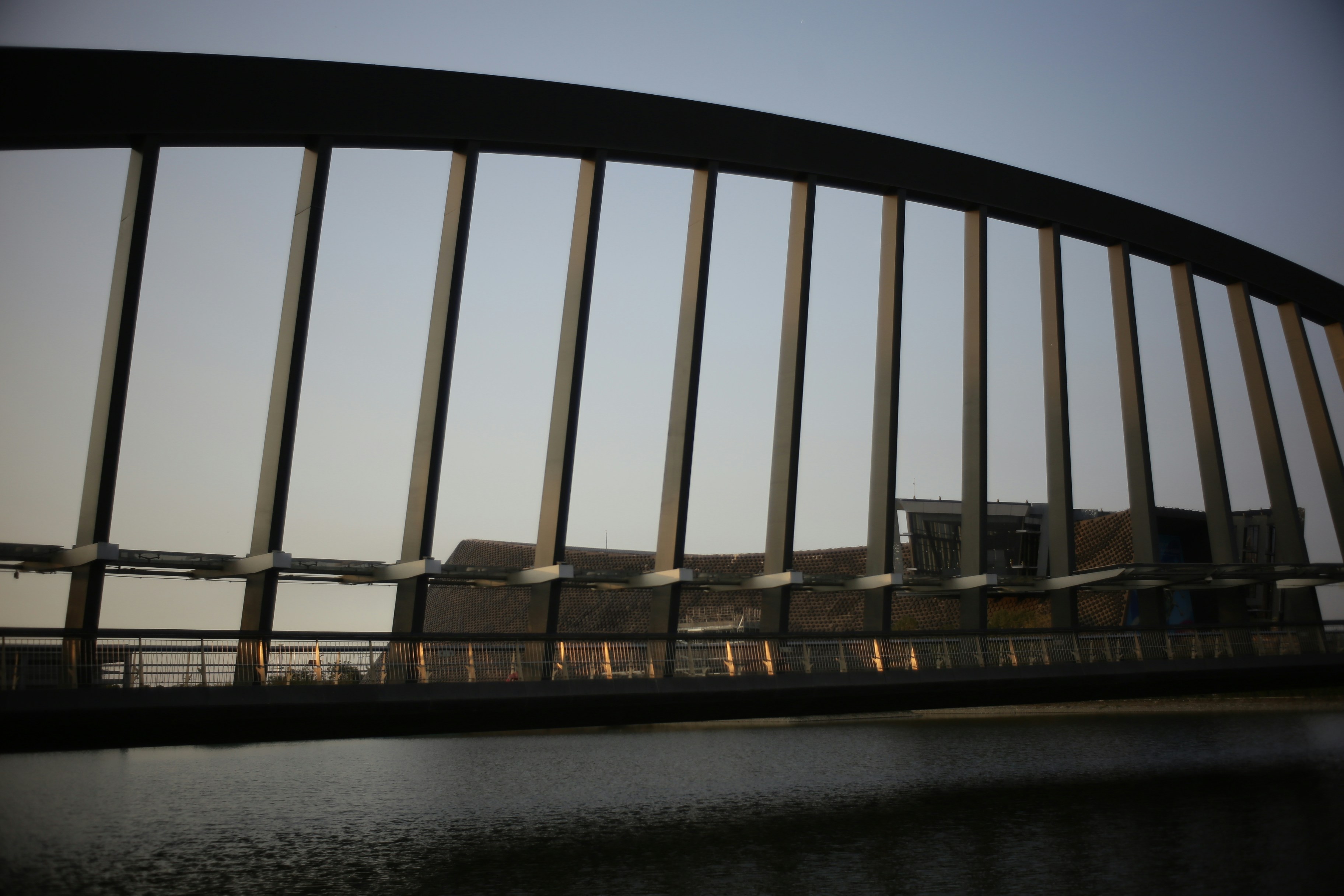 Bridge of Arches: Evening Across the Calm Channel