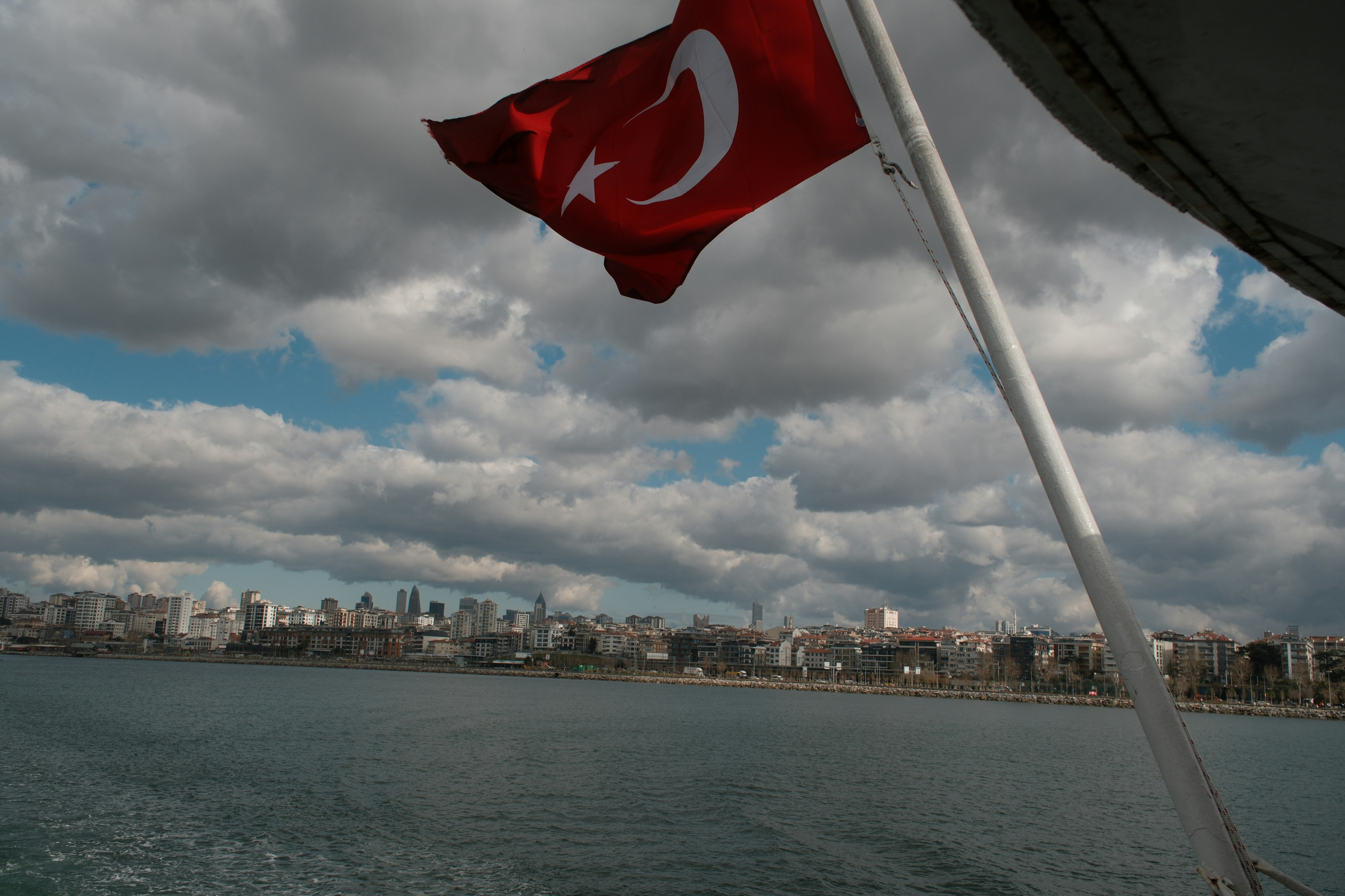 Flag Ripples Over a Waterfront City