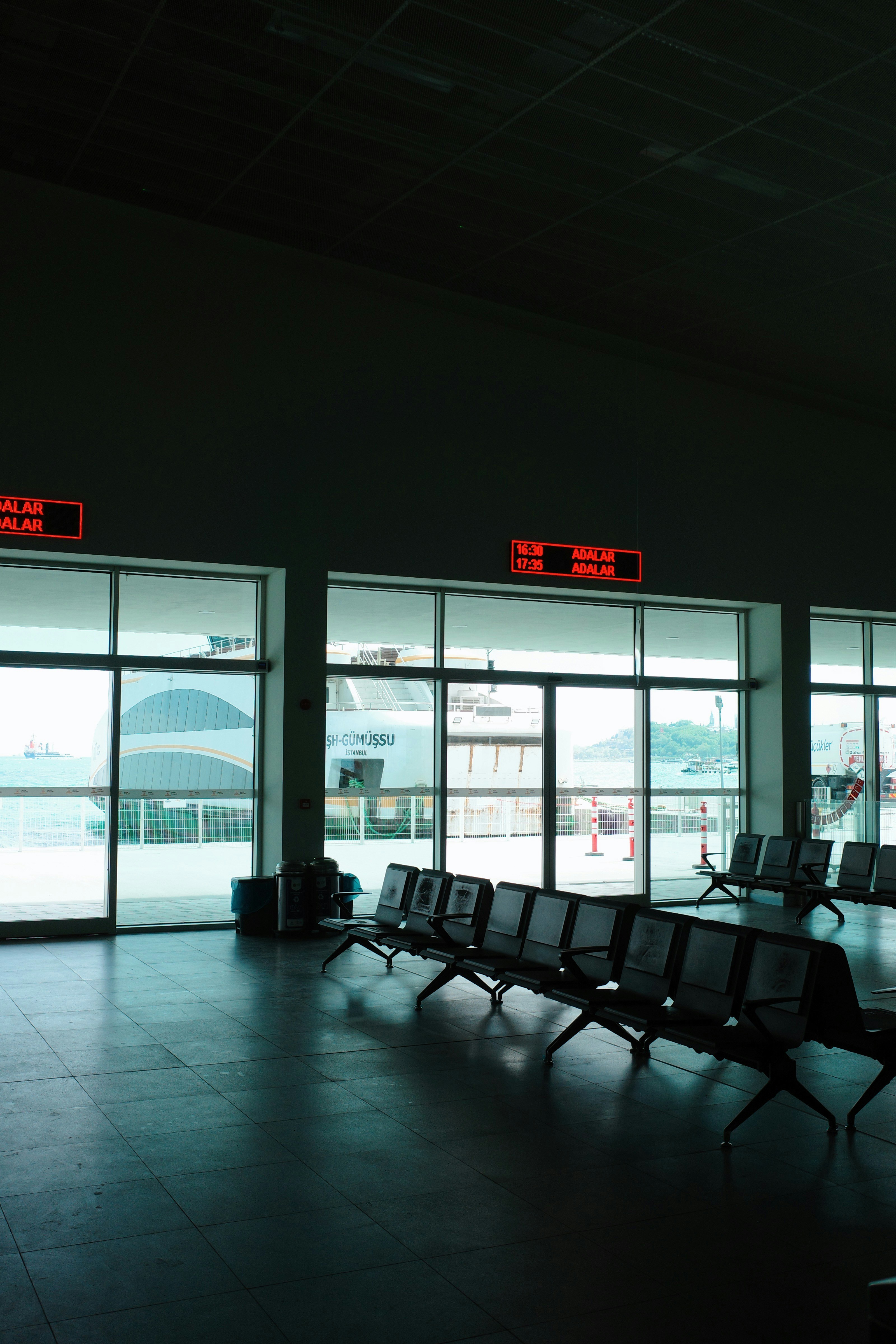 Quiet Terminal Echoes: Evening Light Through Glass Doors
