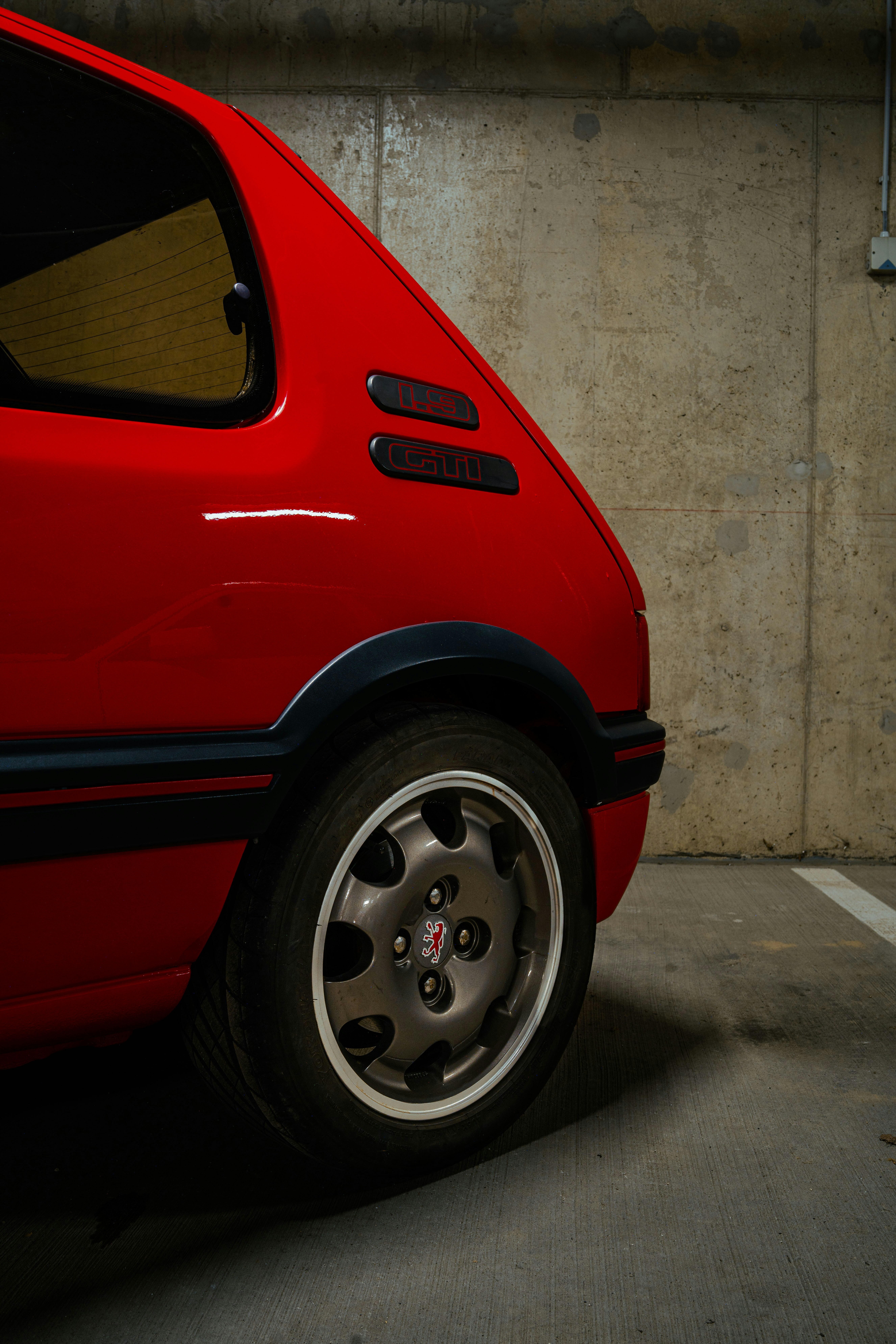 Red Hatchback Corner: A Close-Up of Vibrant Curves and Steel
