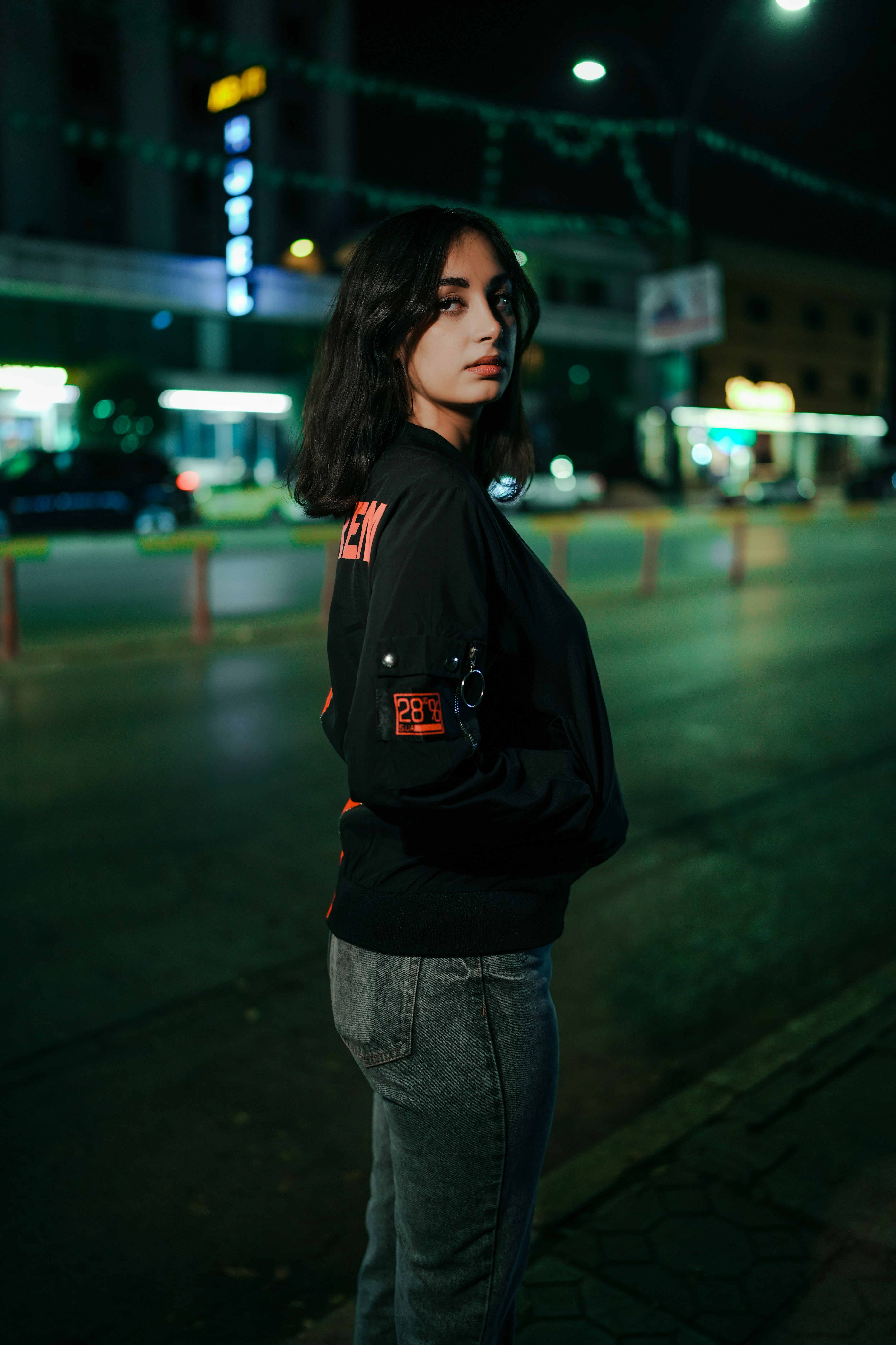 Neon Night Gaze: A Quiet Moment on the Urban Street