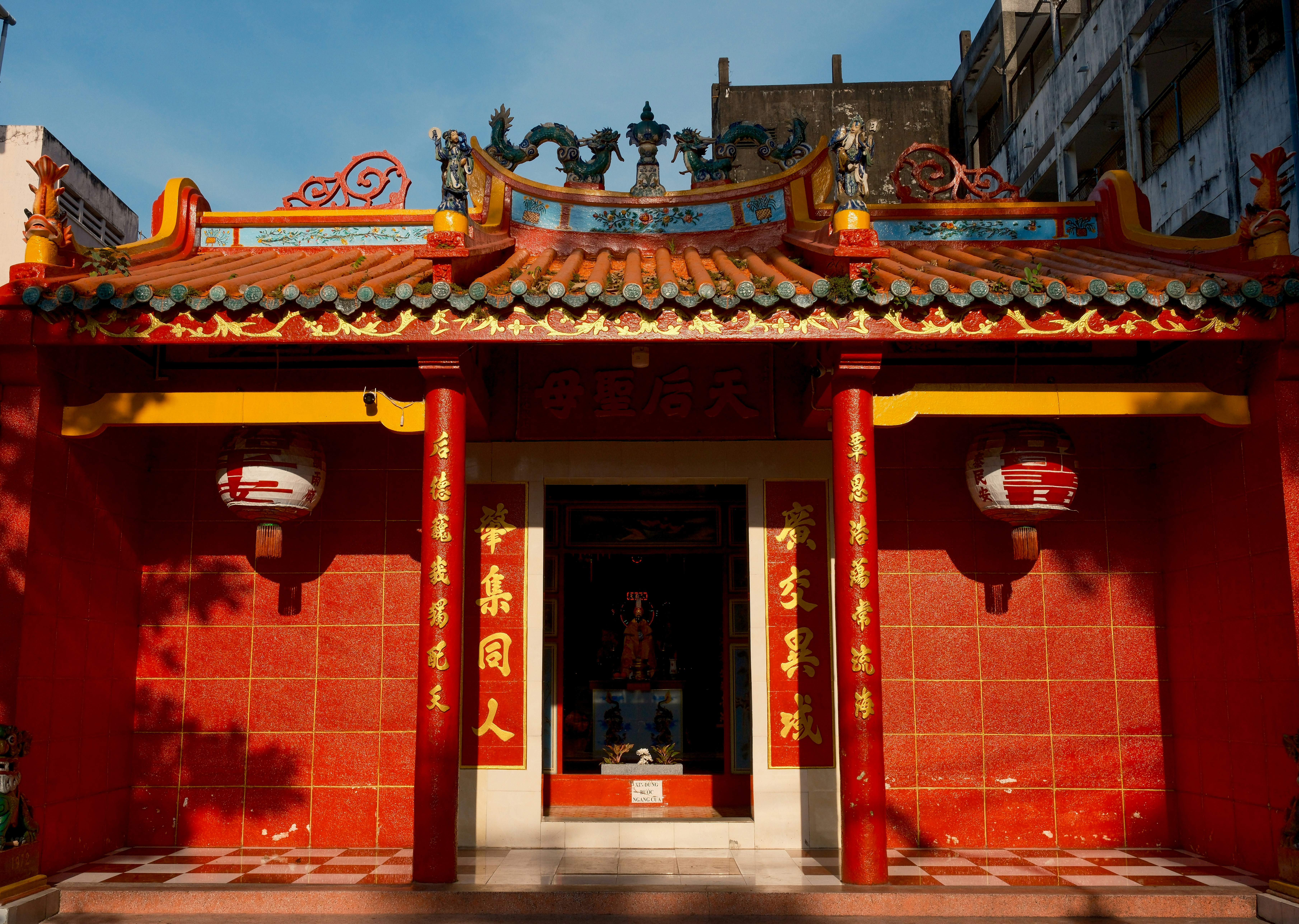 Red Lanterns and Golden Dragons: A Temple Framed by Bold Colonnades