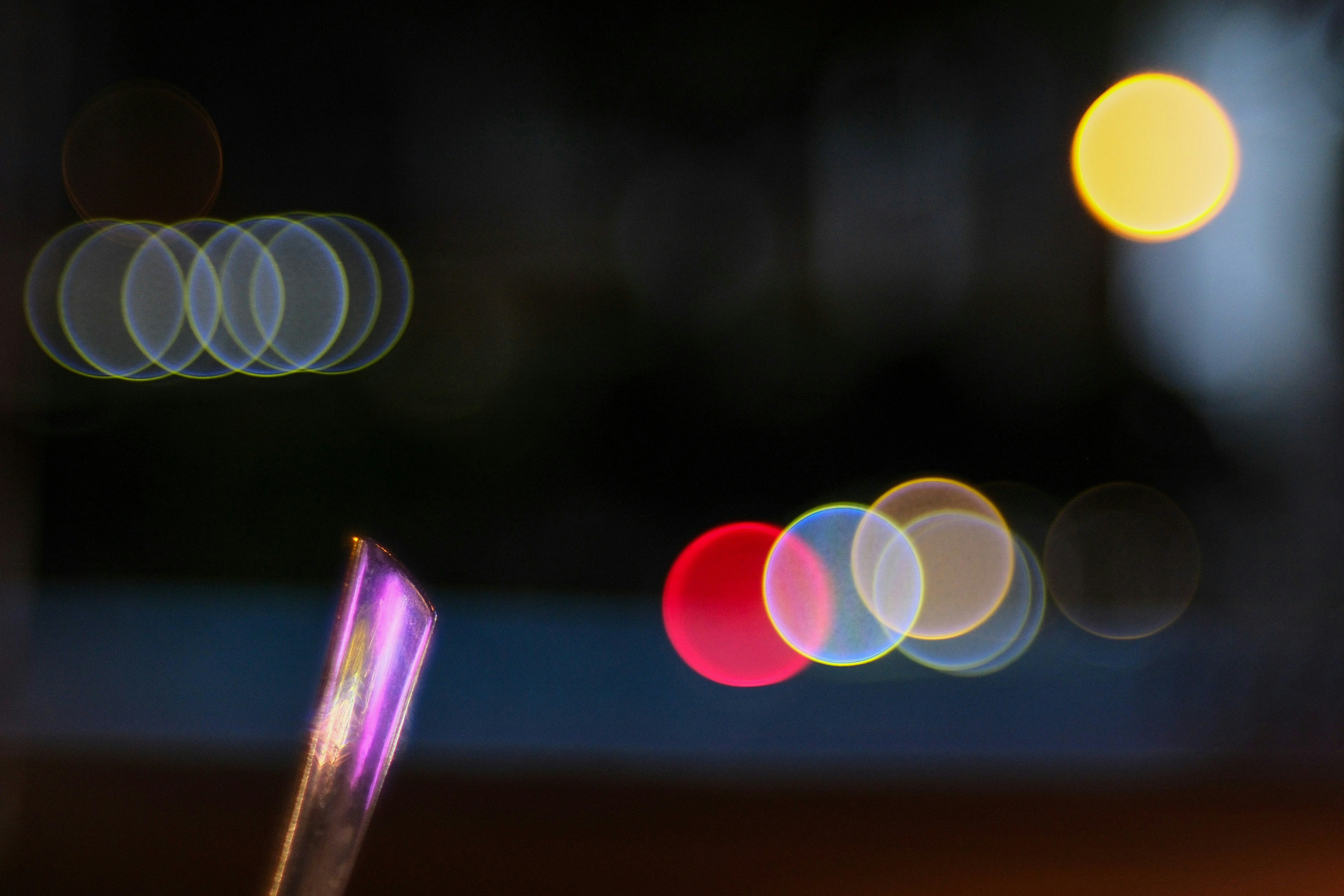 Floating Orbs: Neon Bokeh at Night