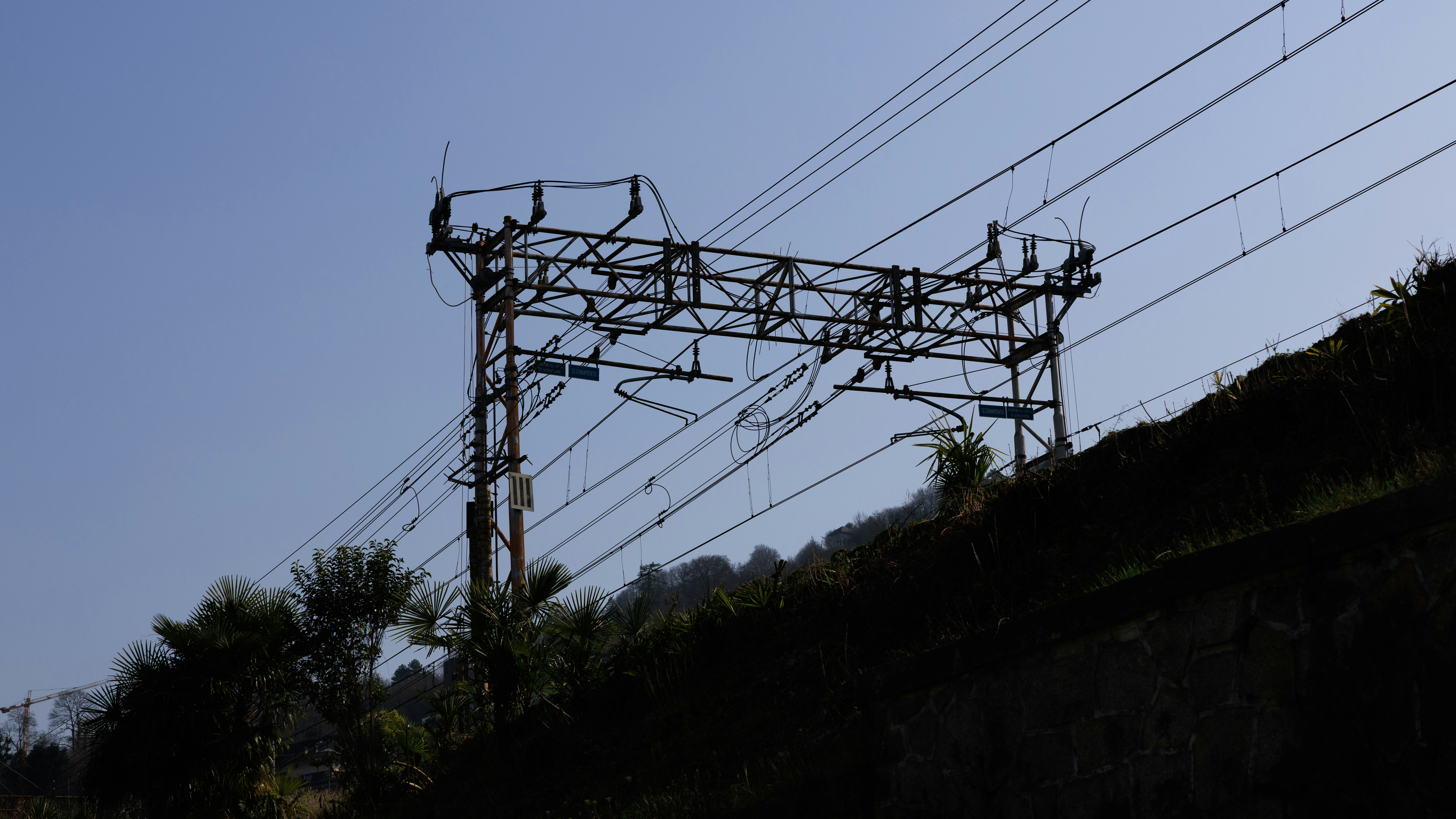Overhead Grid: Power Lines Crossing a Sloped hillside