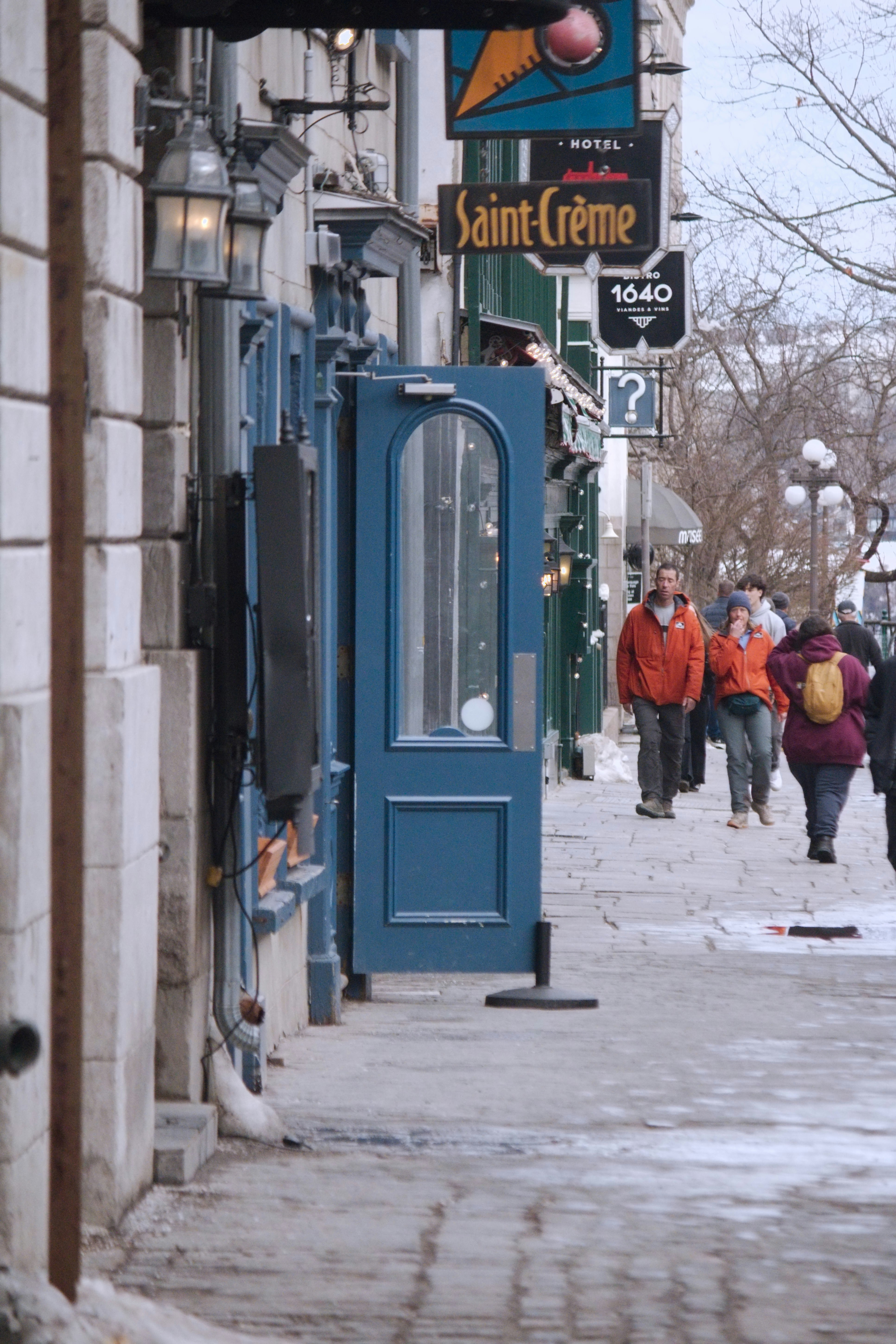 Blue Doorway Street: A Parisian Pedestrian Moment