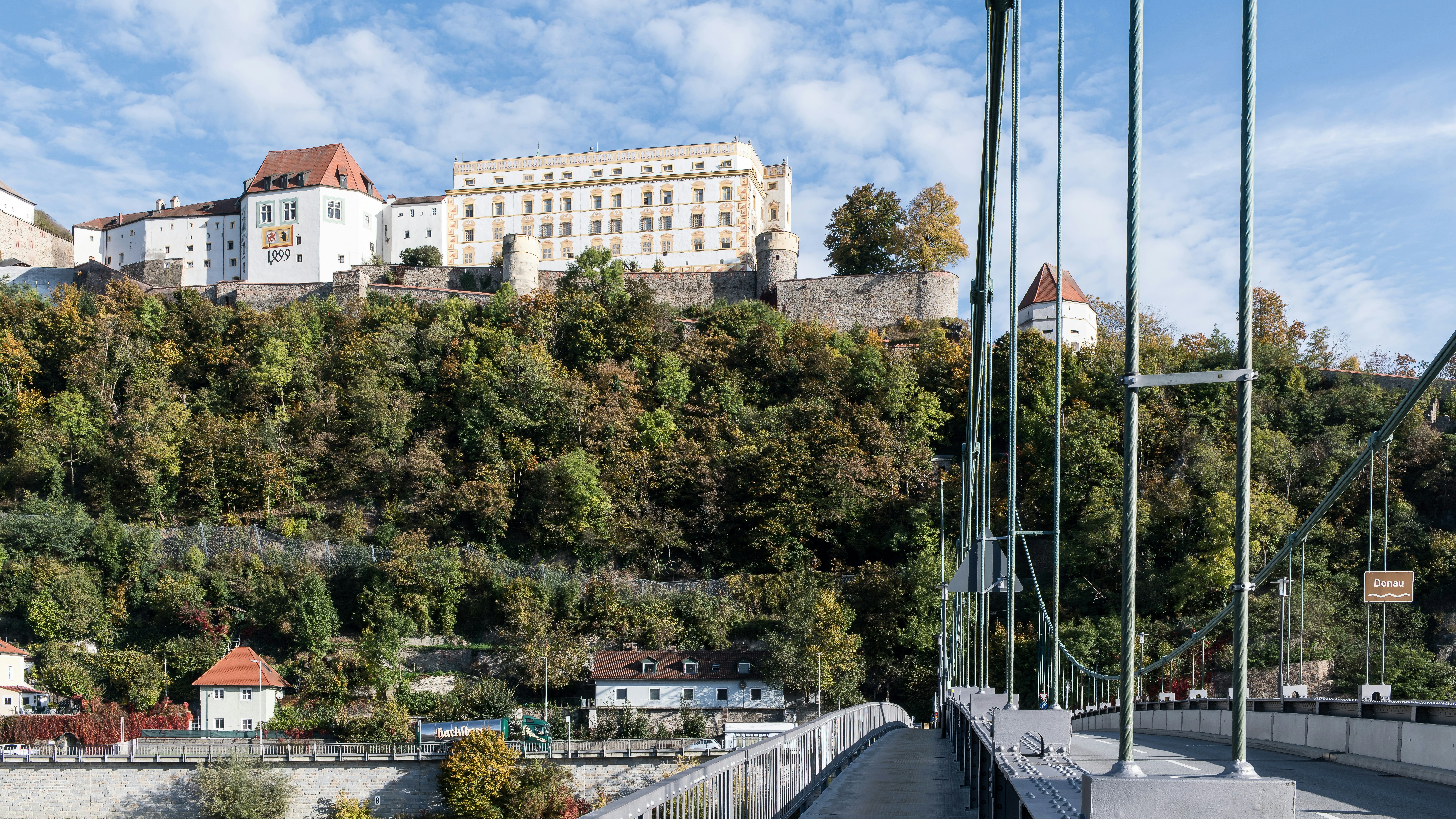 Castle Overlook: A Riverside Bridge Framing a Historic Fortress