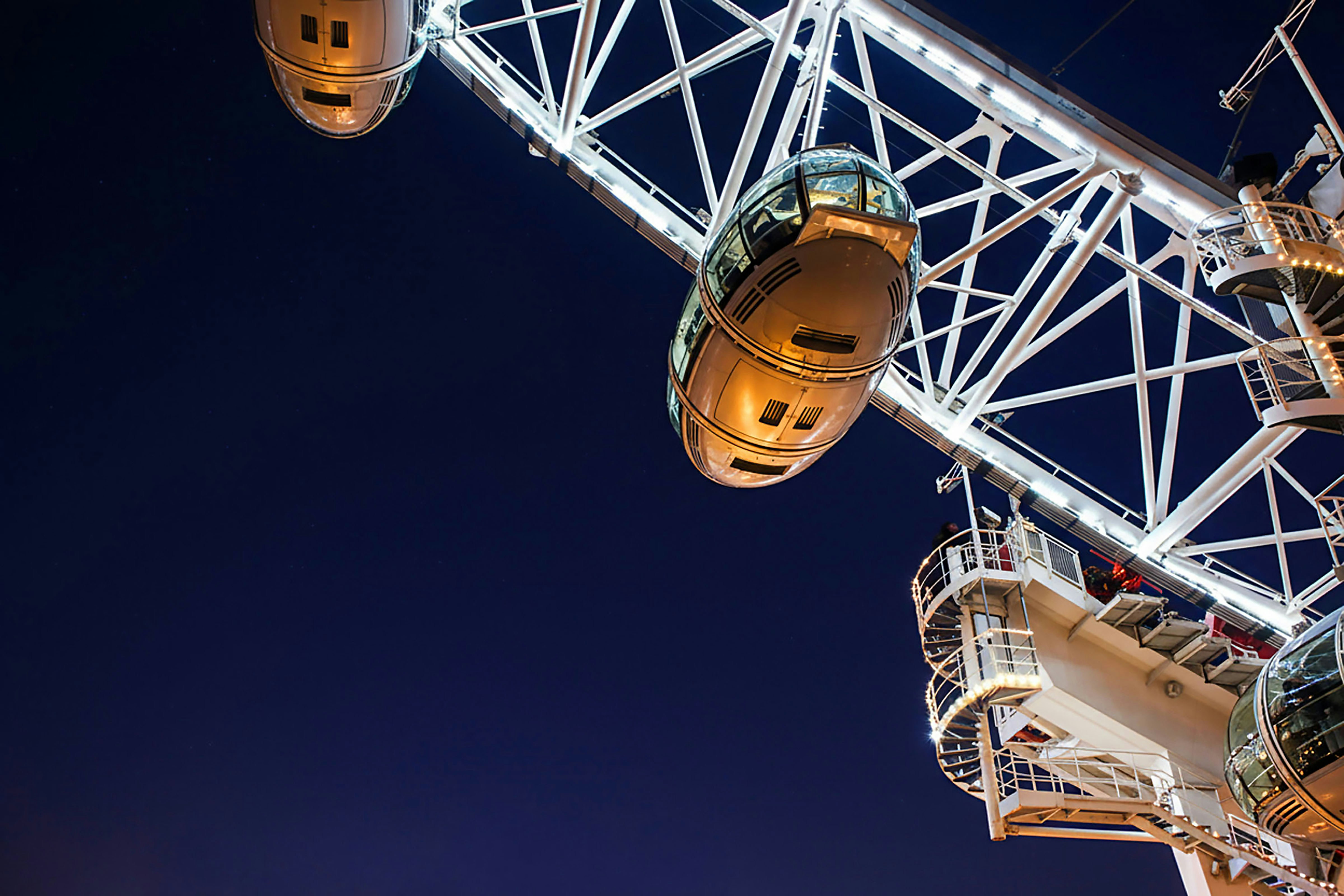 Nighttime Capsule: The London Eye in Neon Silence