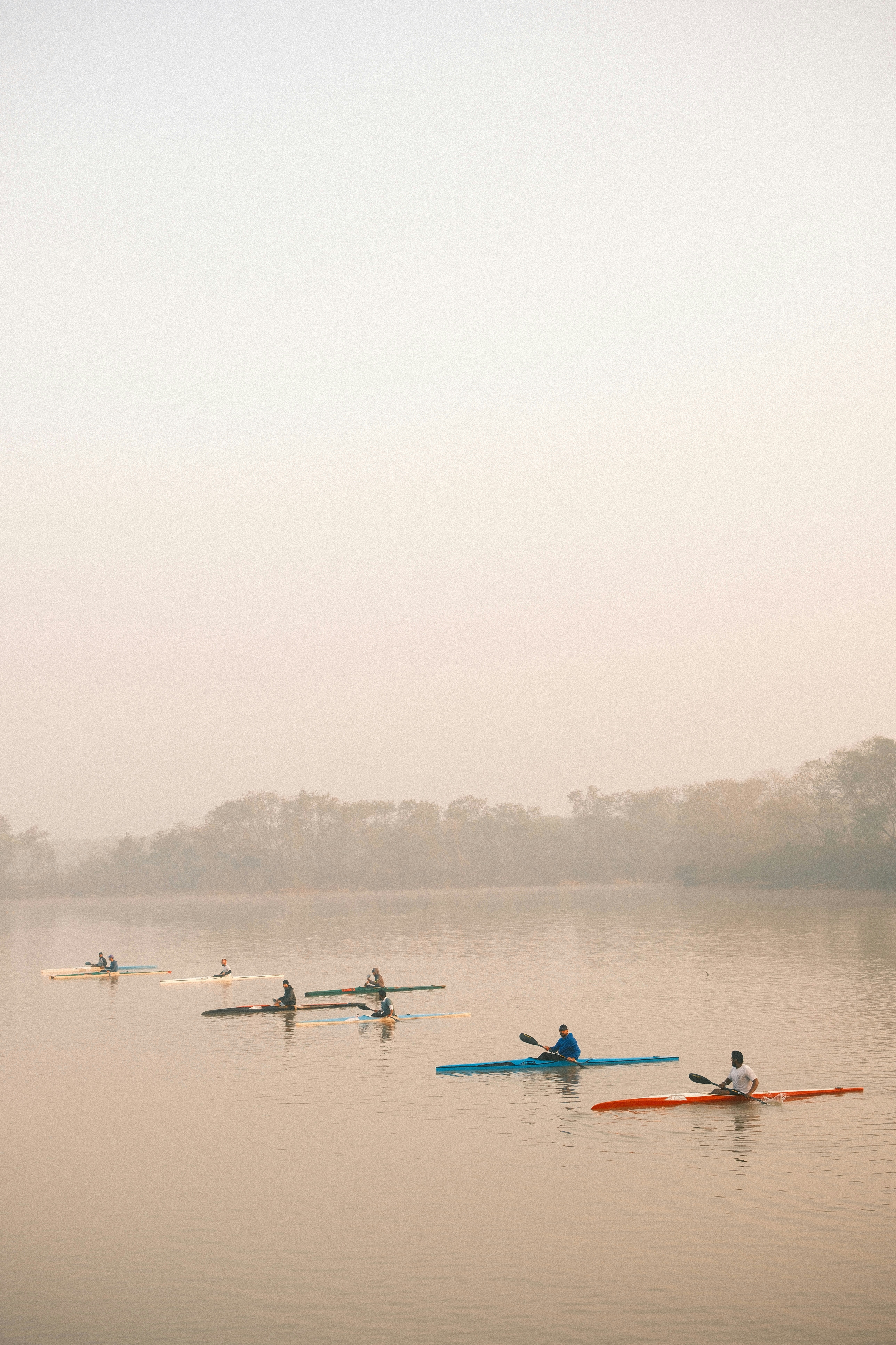 Quiet River Row: a Misty Morning of Kayaks and Dawn