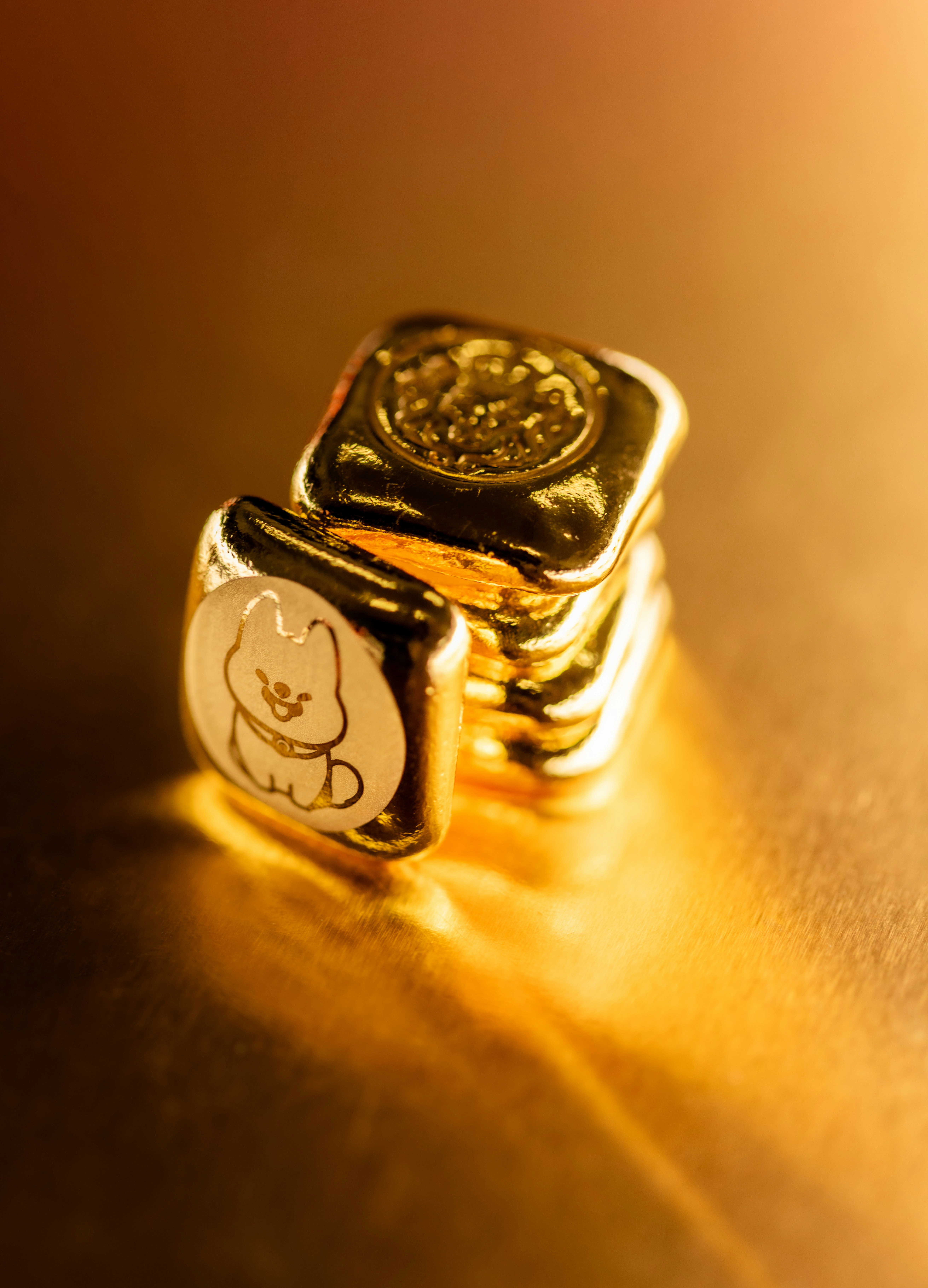 Small Cheerful Charm: A Dog-Mooded Emblem on Golden Steel