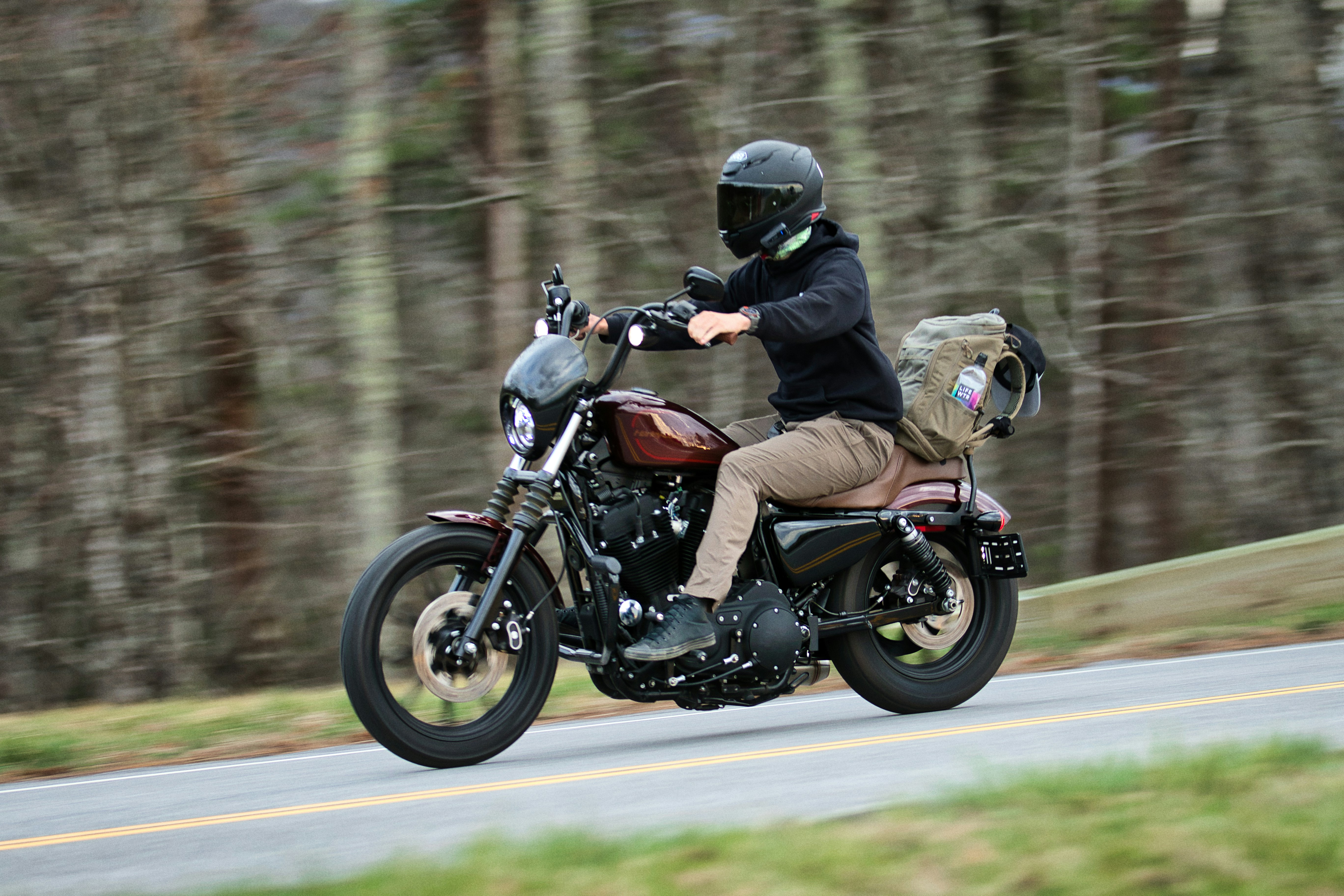 Mid-Adventure Ride: A rider braving leaf-strewn backroad
