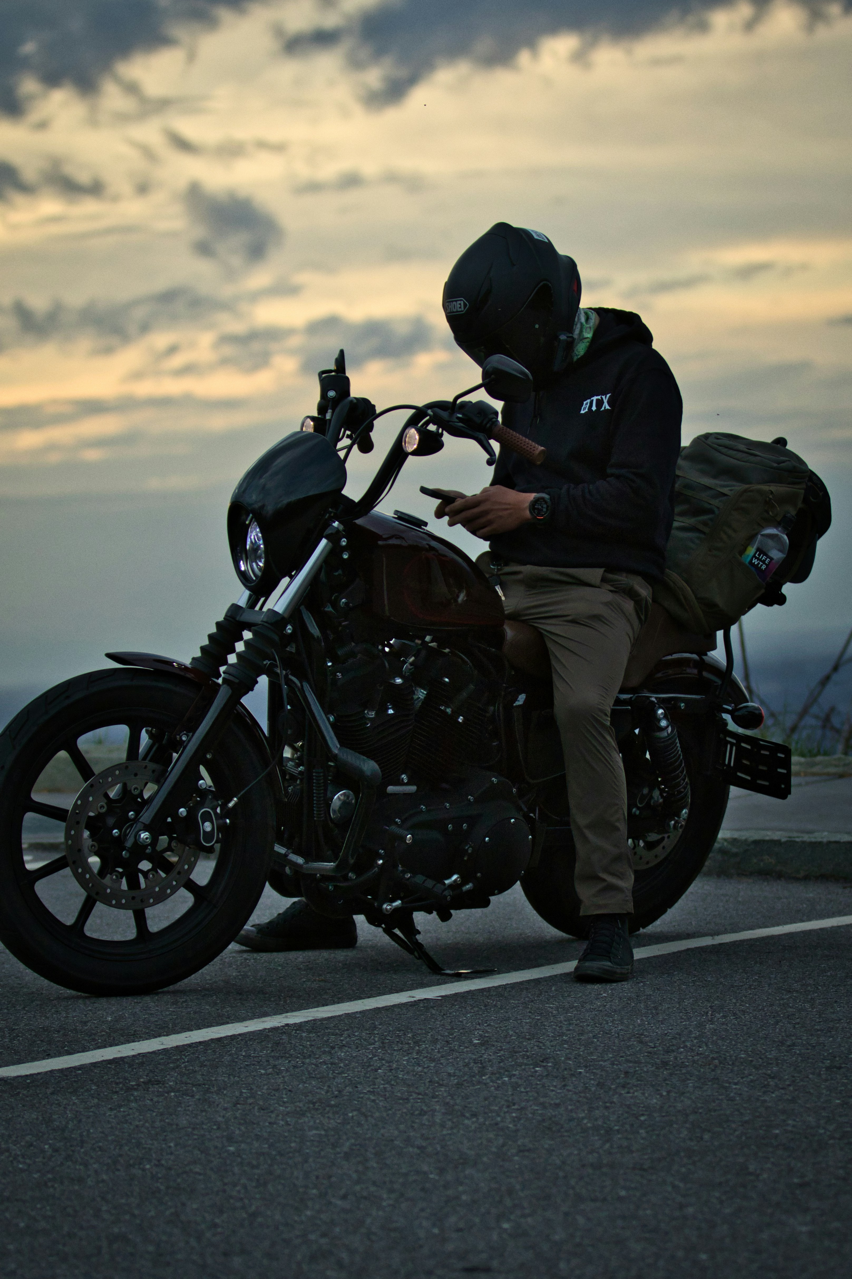 Night Ride Noir: A Rider Glance on the Distant Horizon